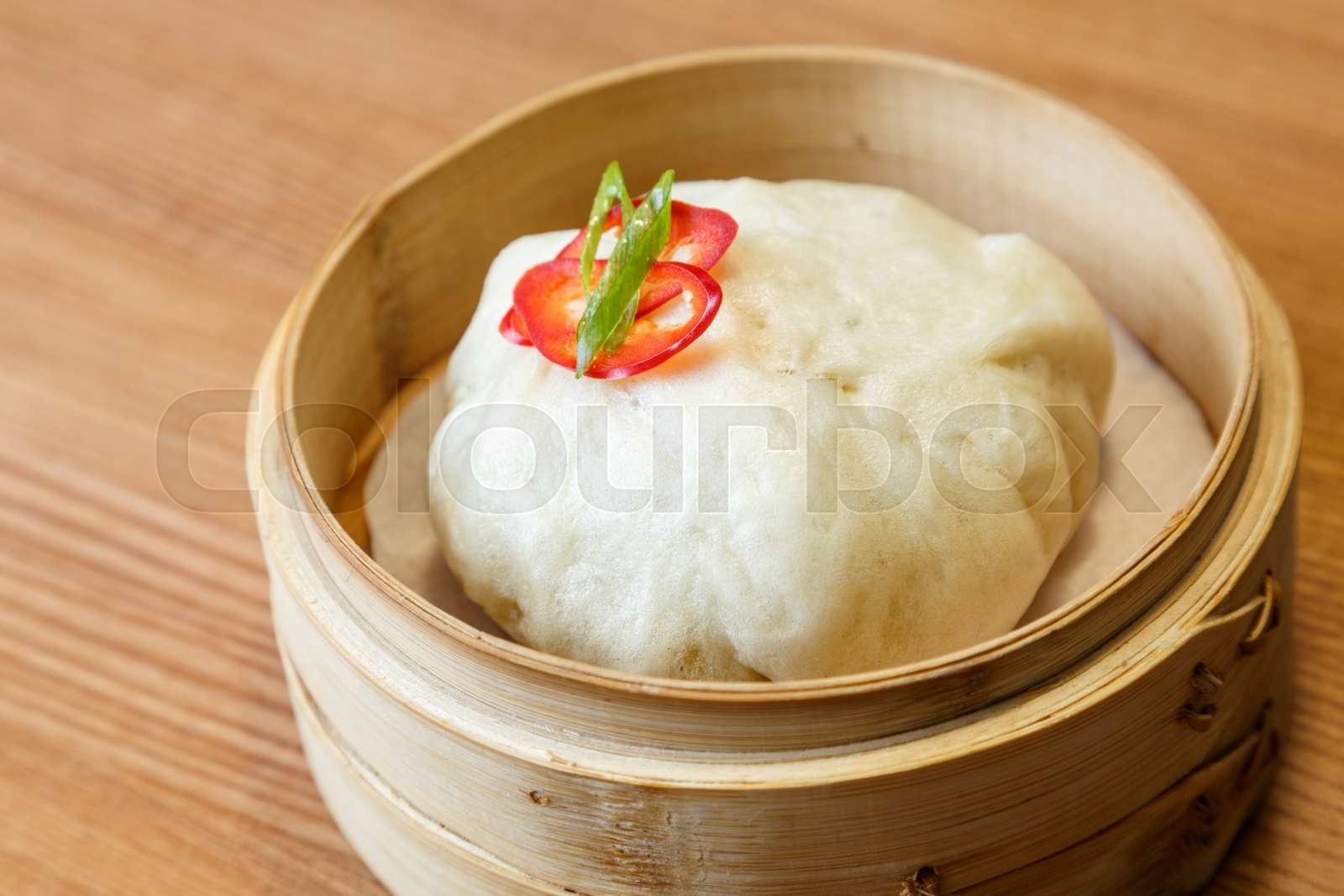 Asian steam bun in a bamboo steamer | Stock image | Colourbox