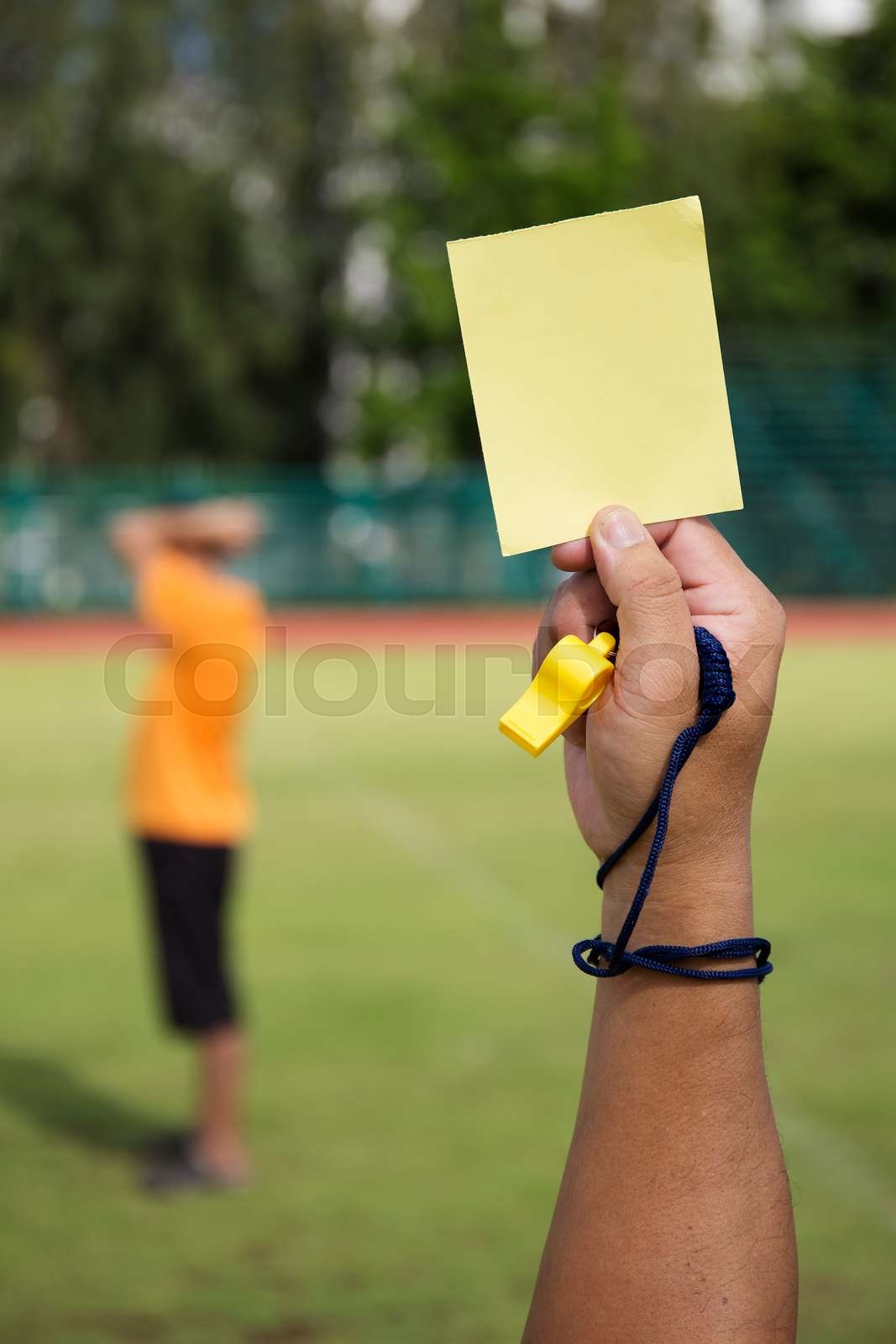 soccer Referee show yellow card | Stock image | Colourbox