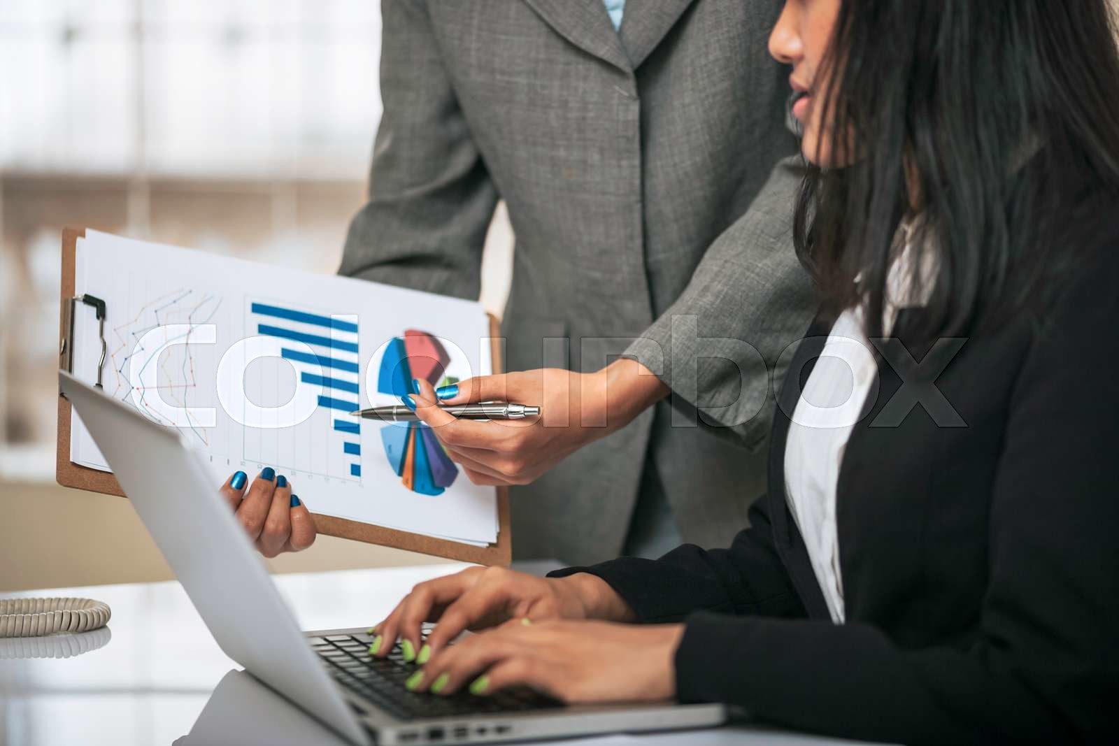 employees showing graphics | Stock image | Colourbox