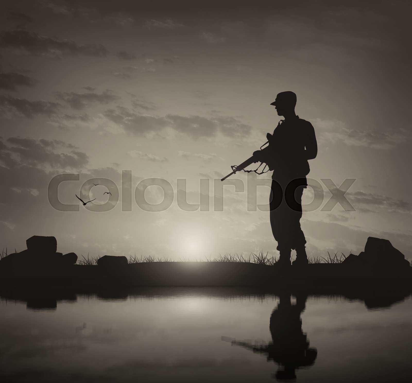 Silhouette of a terrorist with a weapon | Stock image | Colourbox