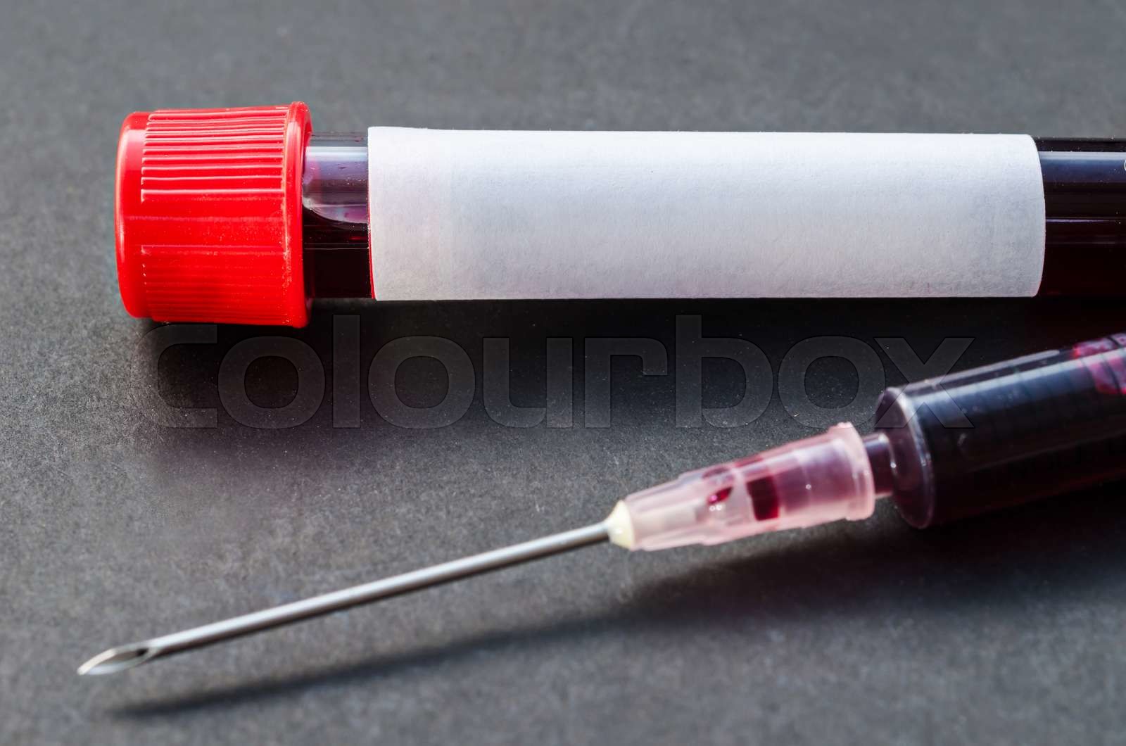 Blood sample in tube and syringe. | Stock image | Colourbox