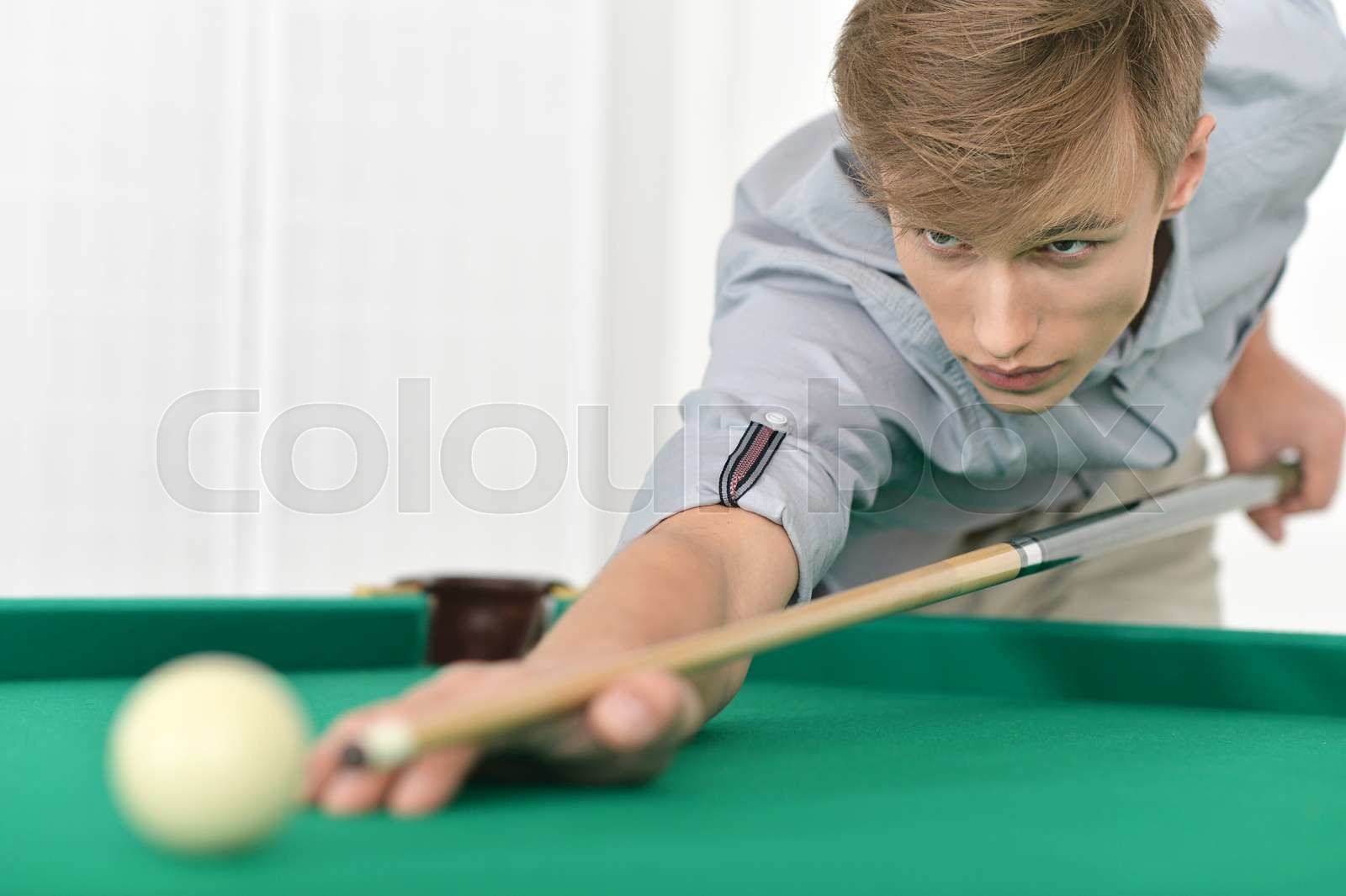 man playing billiards in billiard club | Stock image | Colourbox