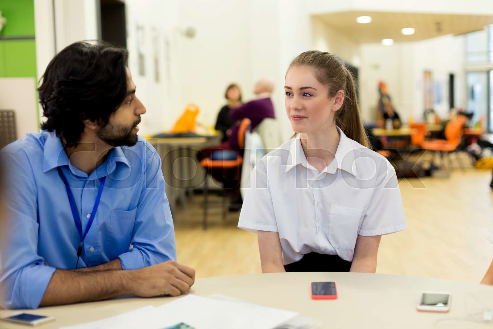 Teacher and Student Chatting | Stock image | Colourbox