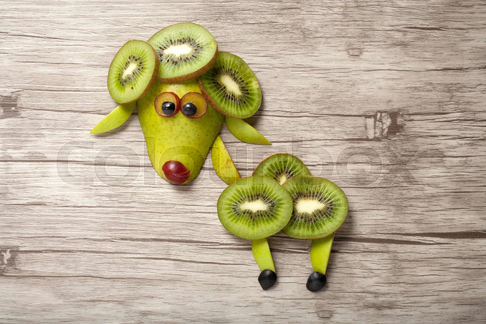 Amusing sheep made of fruits on desk | Stock image | Colourbox