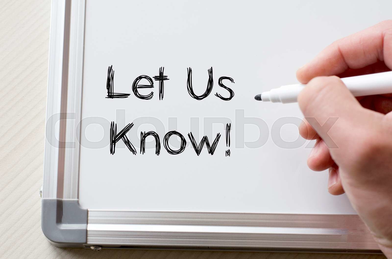 Let us know written on whiteboard | Stock image | Colourbox