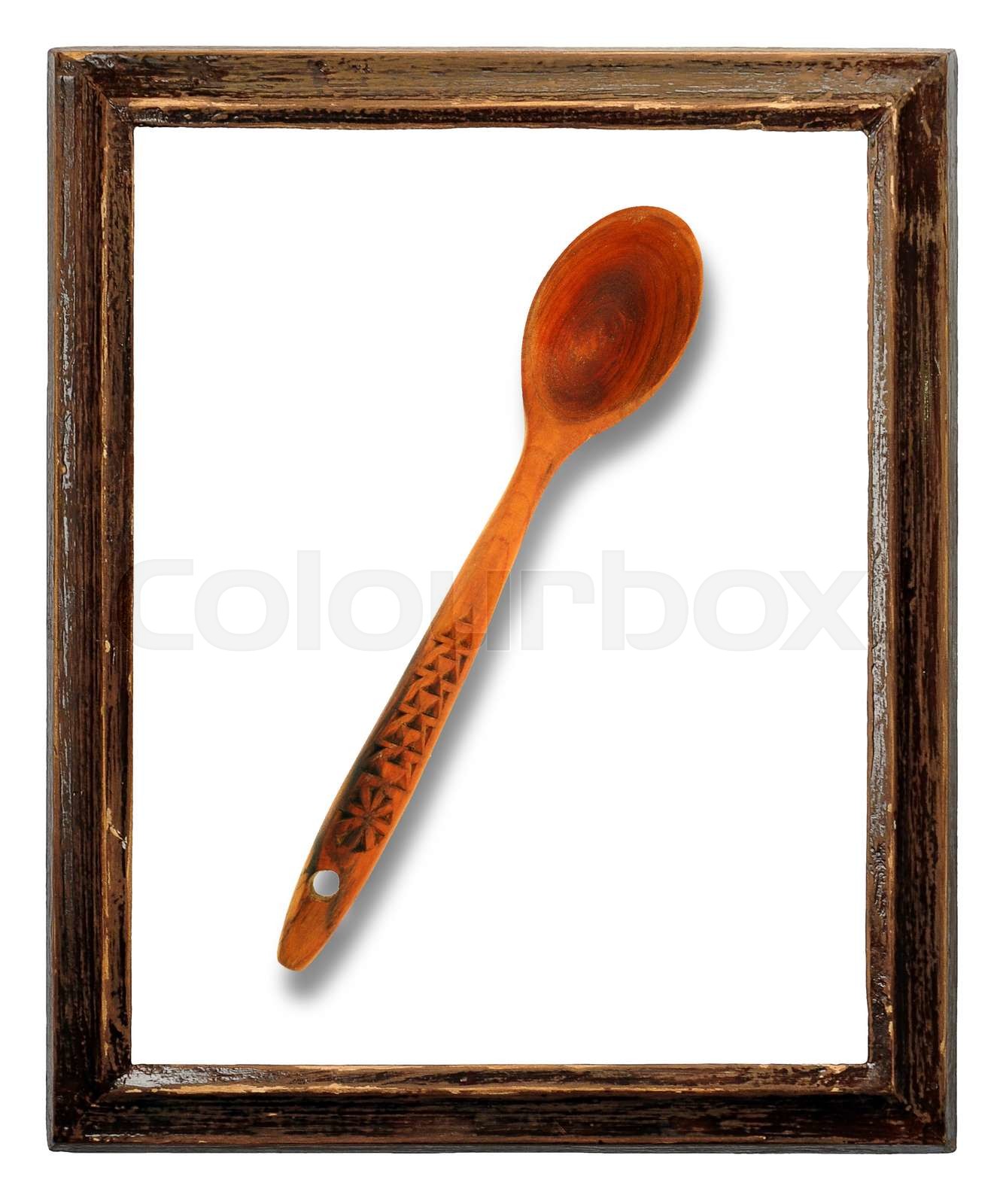 wooden spoon in a frame | Stock image | Colourbox
