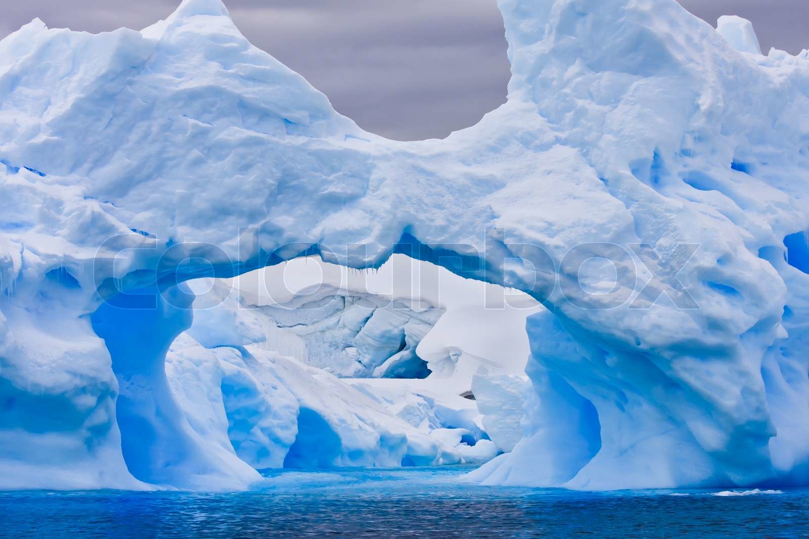 Large Antarctic iceberg with a cavity inside | Stock image | Colourbox