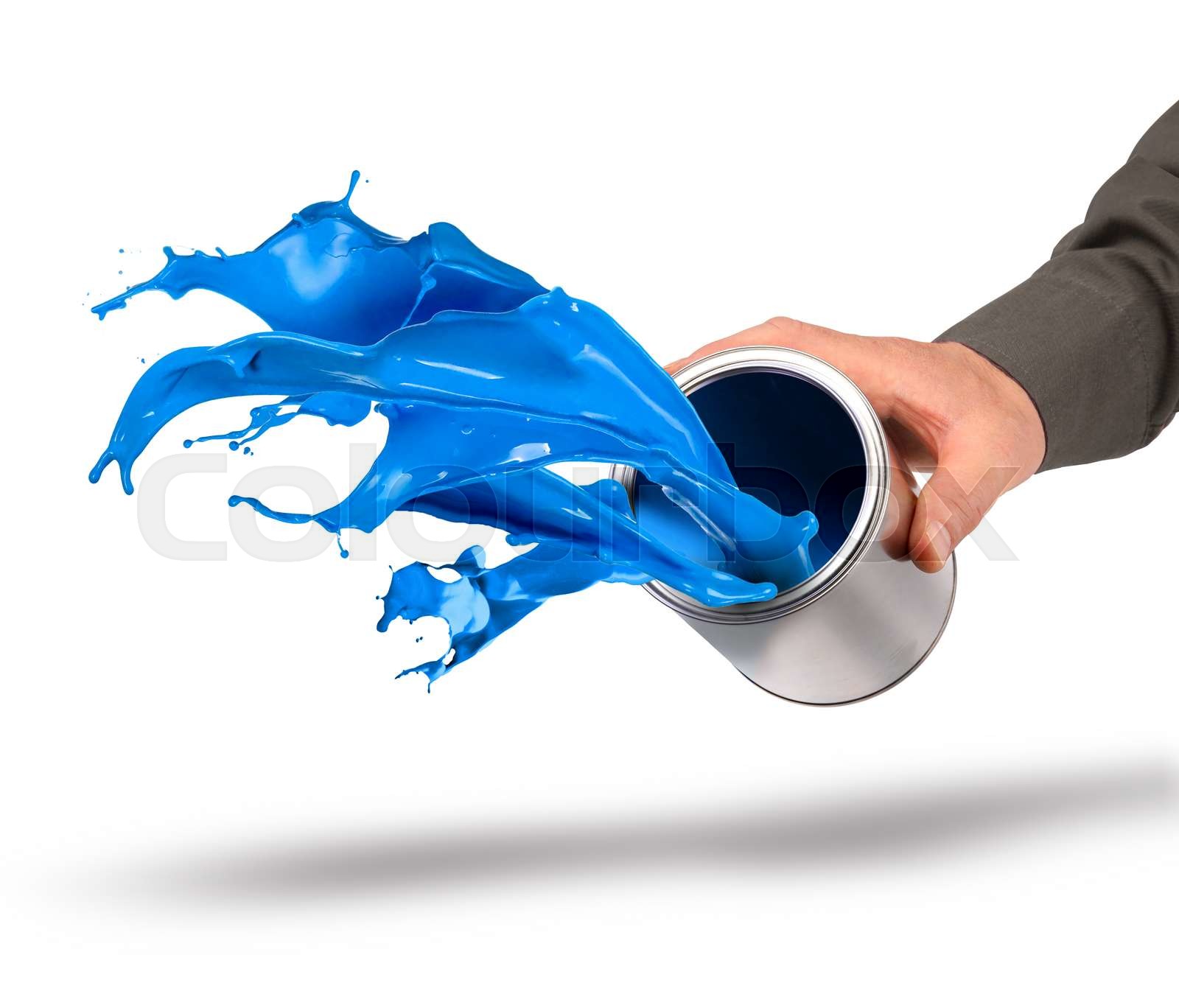 Hand throwing blue paint from can | Stock image | Colourbox
