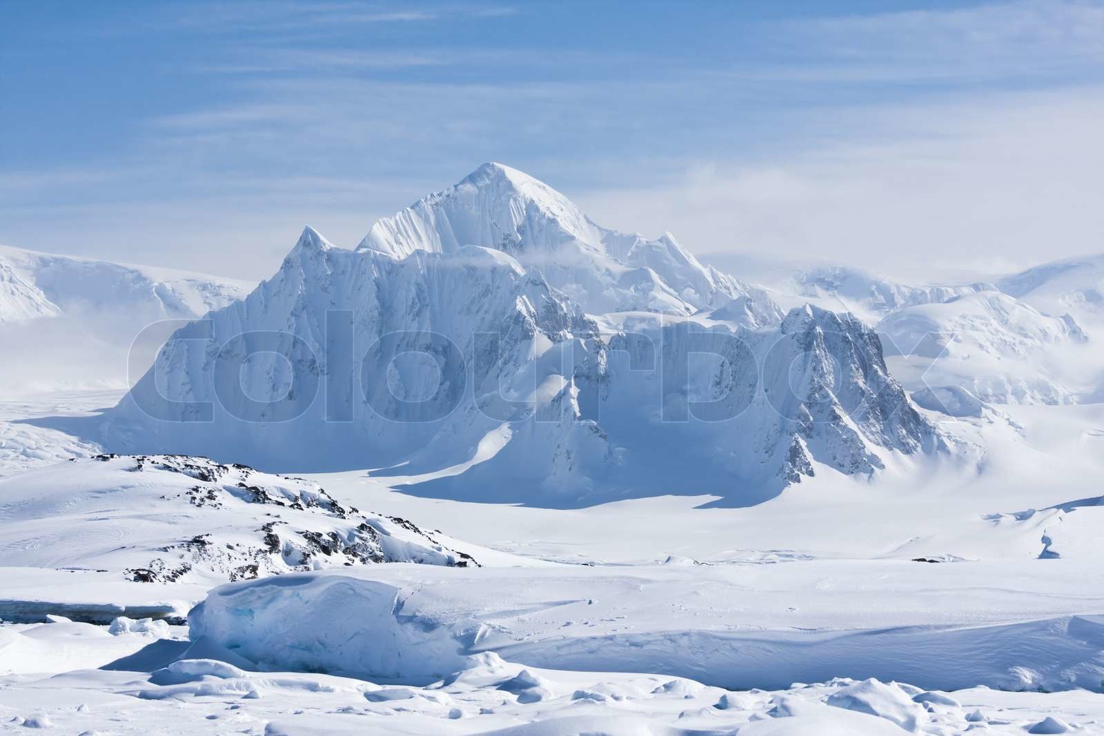 mountain peak is covered with white snow in Antarctica | Stock image ...