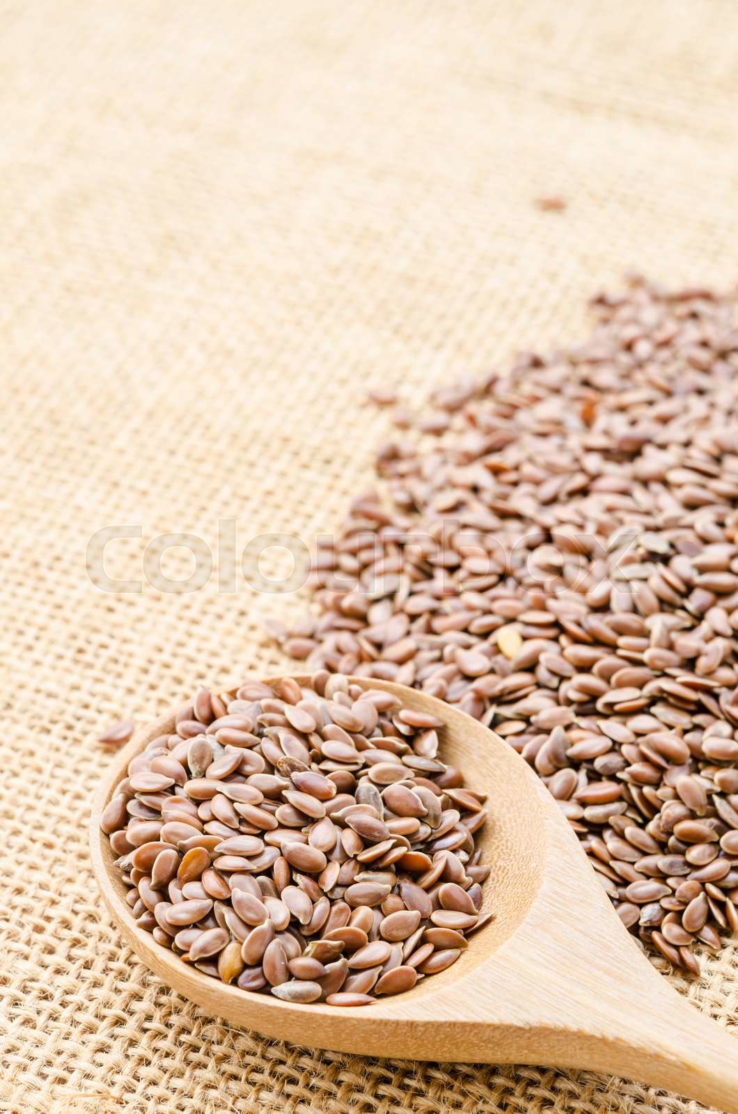 Heap of brown linseed. | Stock image | Colourbox