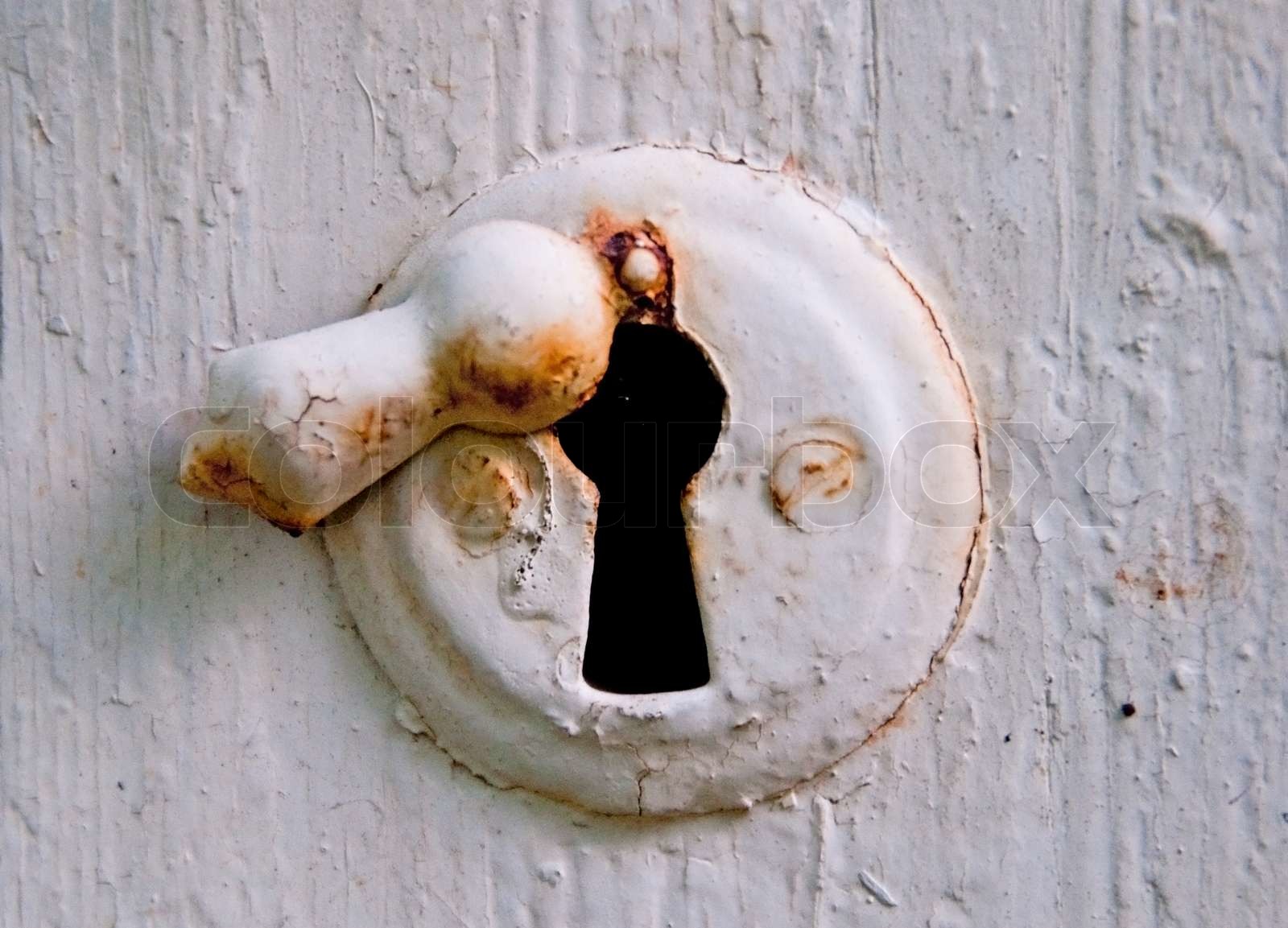 A withe old-fashioned keyhole with escutcheon | Stock image | Colourbox