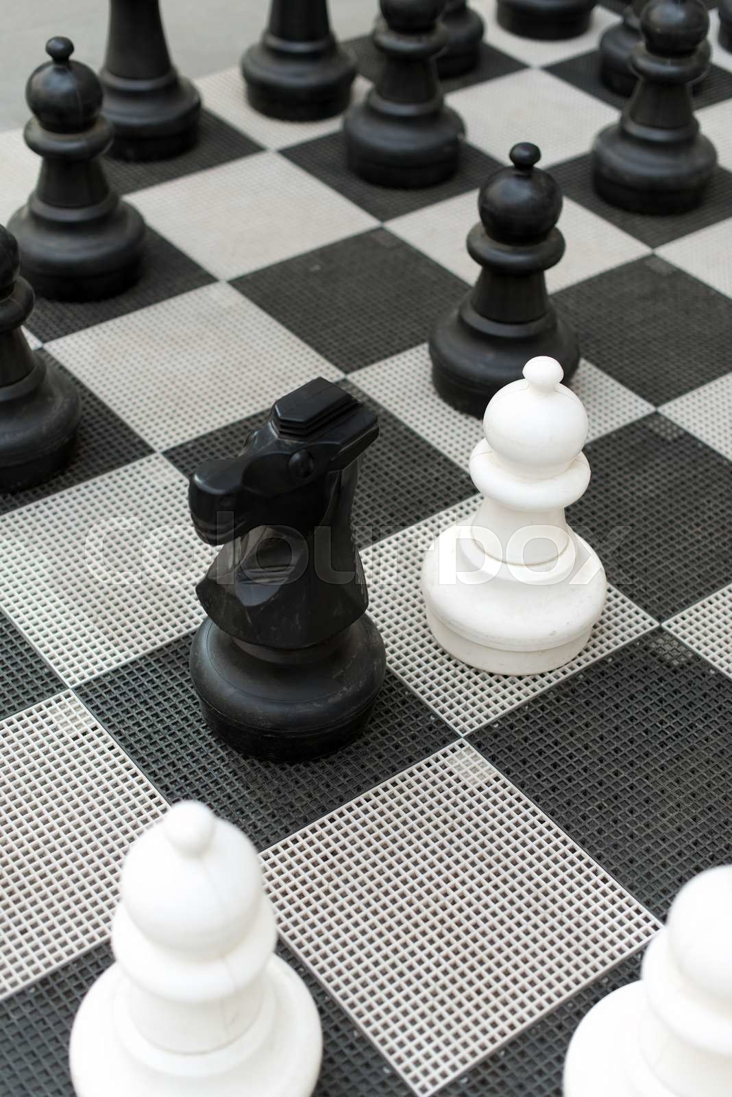 Outdoor chess board with big plastic figures. | Stock image | Colourbox