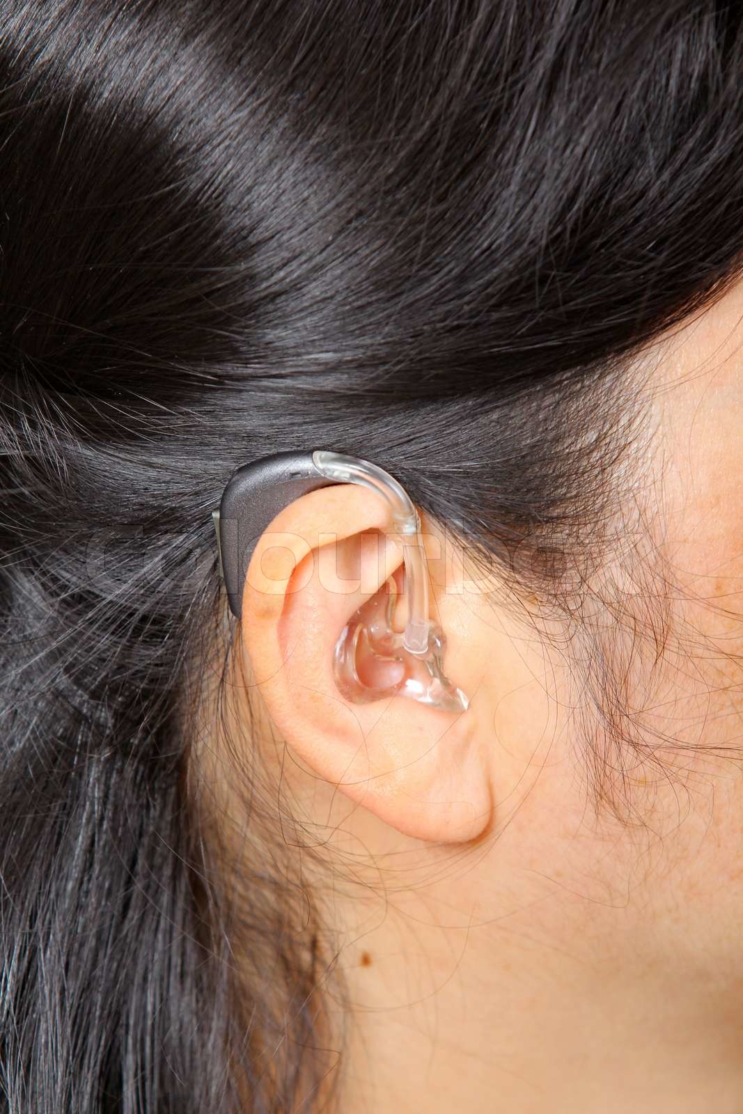 Asian Woman Wearing Hearing Aid Close Up Stock Image Colourbox