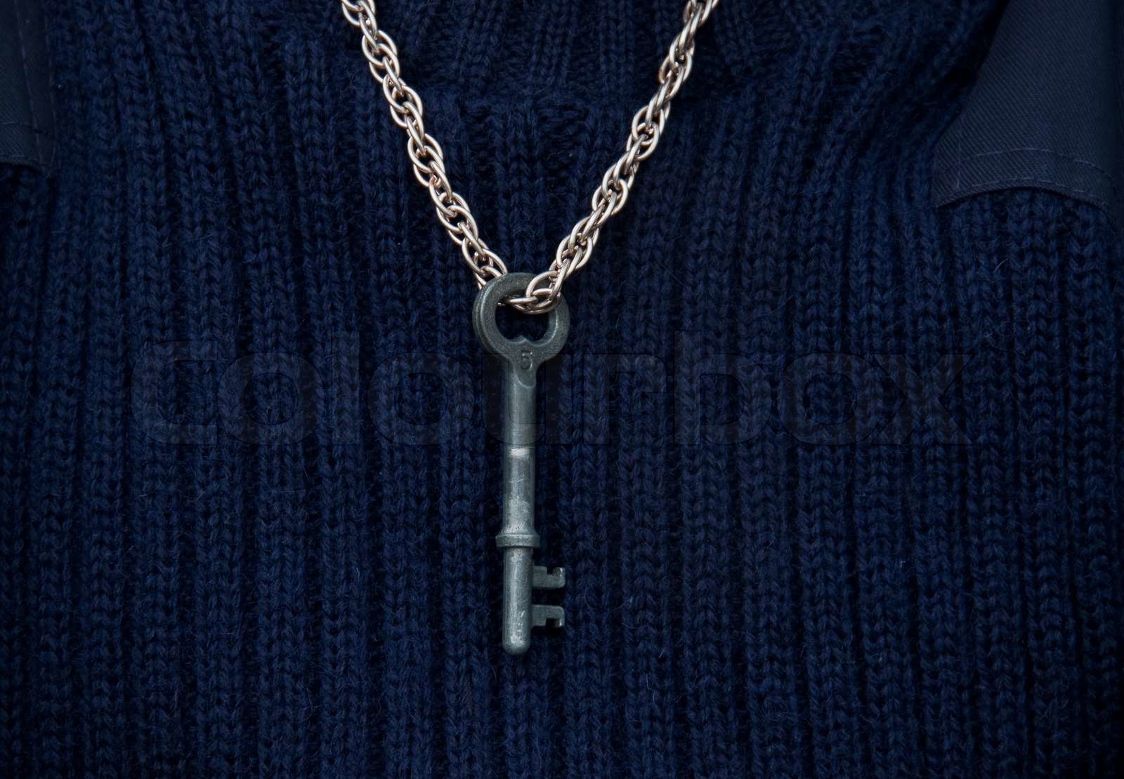 A child wears a key around the neck | Stock image | Colourbox