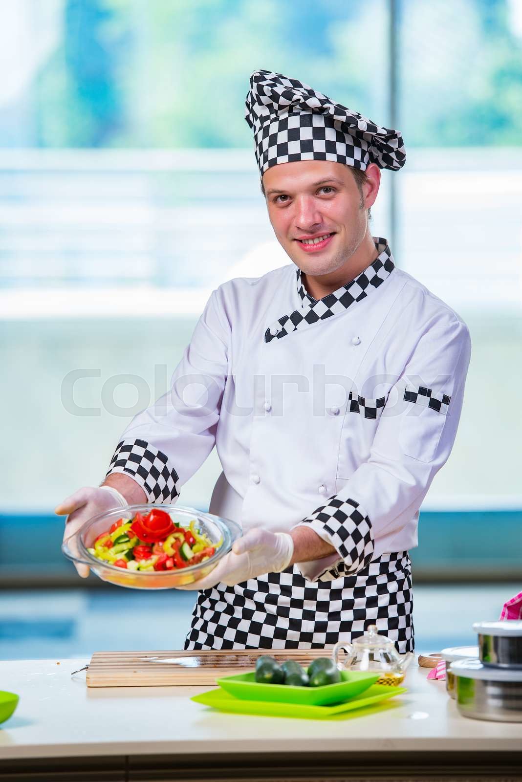Male cook preparing food in the kitchen | Stock image | Colourbox