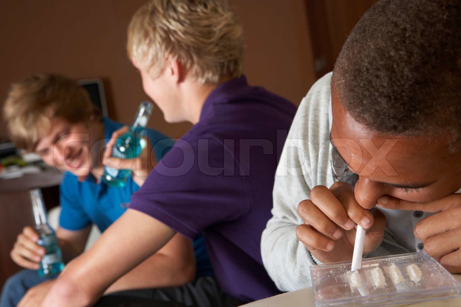 Group Of Teenage Boys Taking Drugs At Home | Stock image | Colourbox