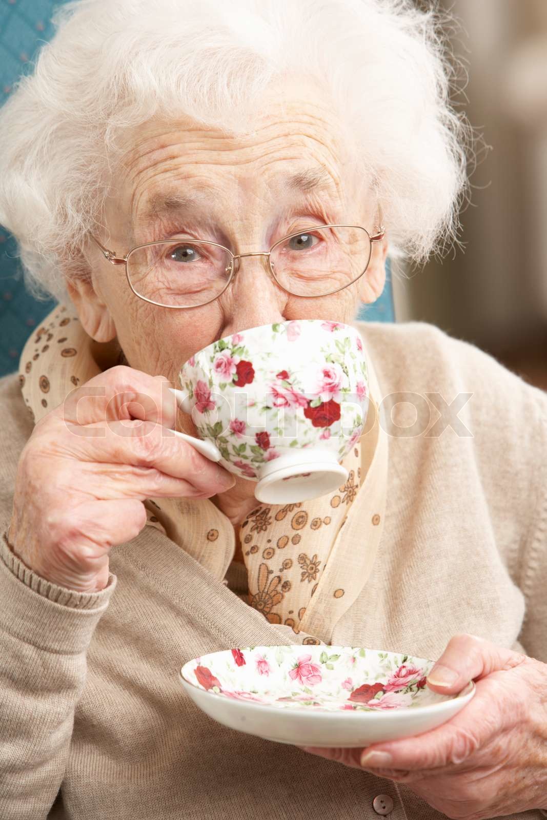 Senior Woman Enjoying Cup Of Tea At Home | Stock image | Colourbox