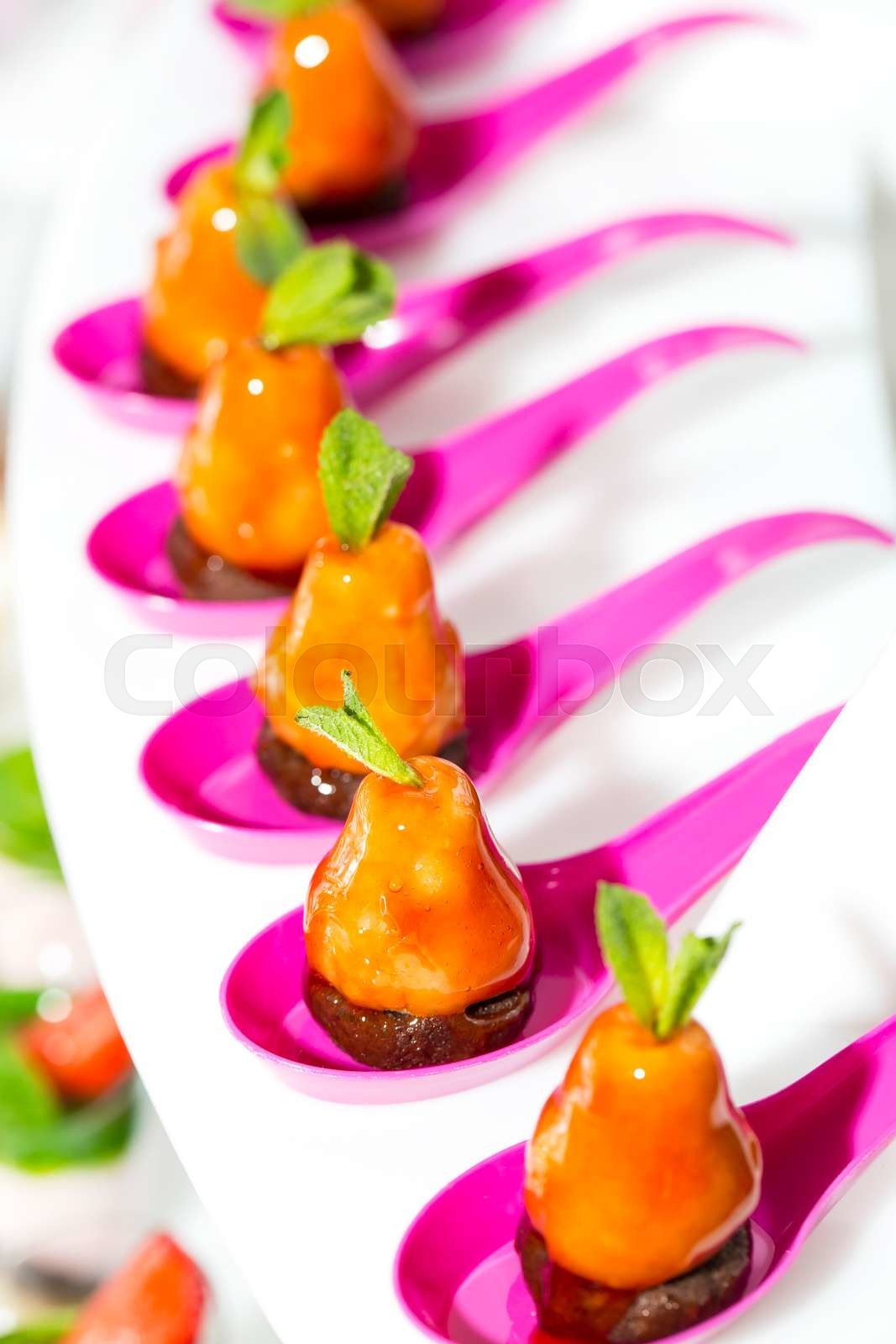 mini canapes in plastic cups decorated with edible flowers | Stock ...