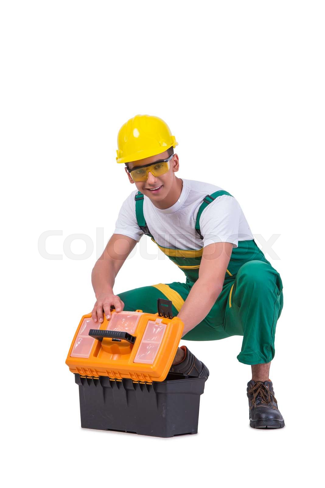 Young man with toolkit toolbox isolated on white | Stock image | Colourbox