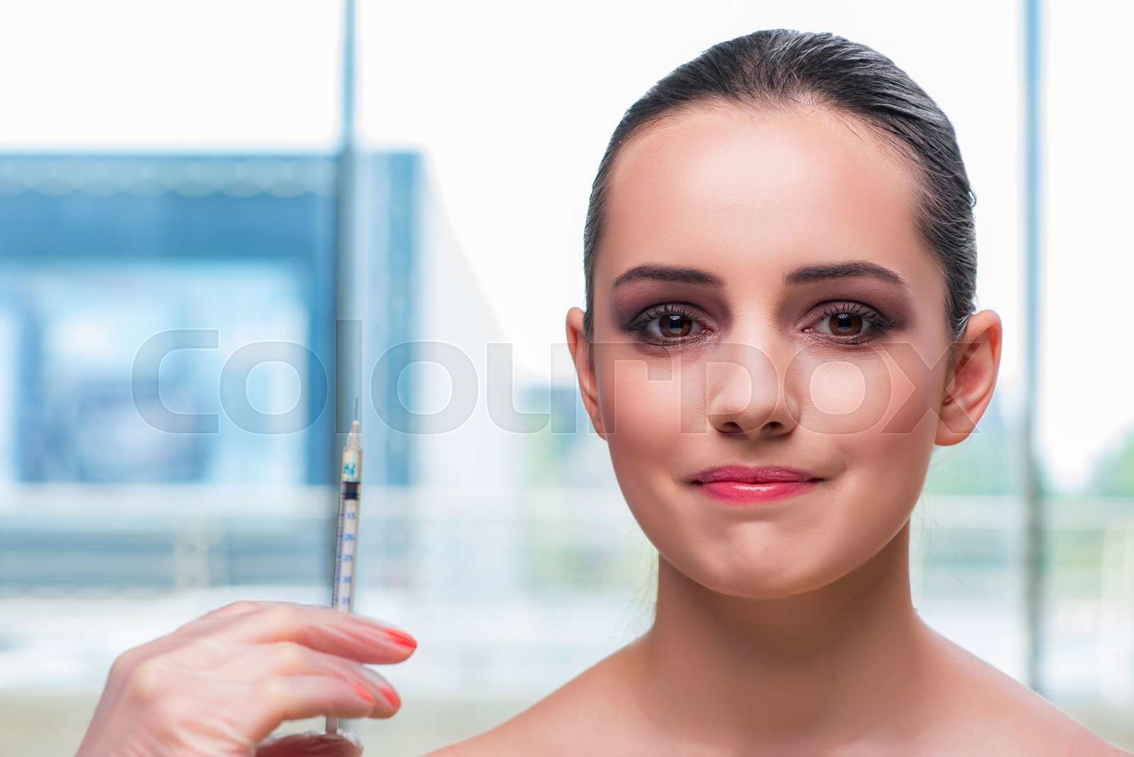 Beautiful woman preparing for botox injection | Stock image | Colourbox