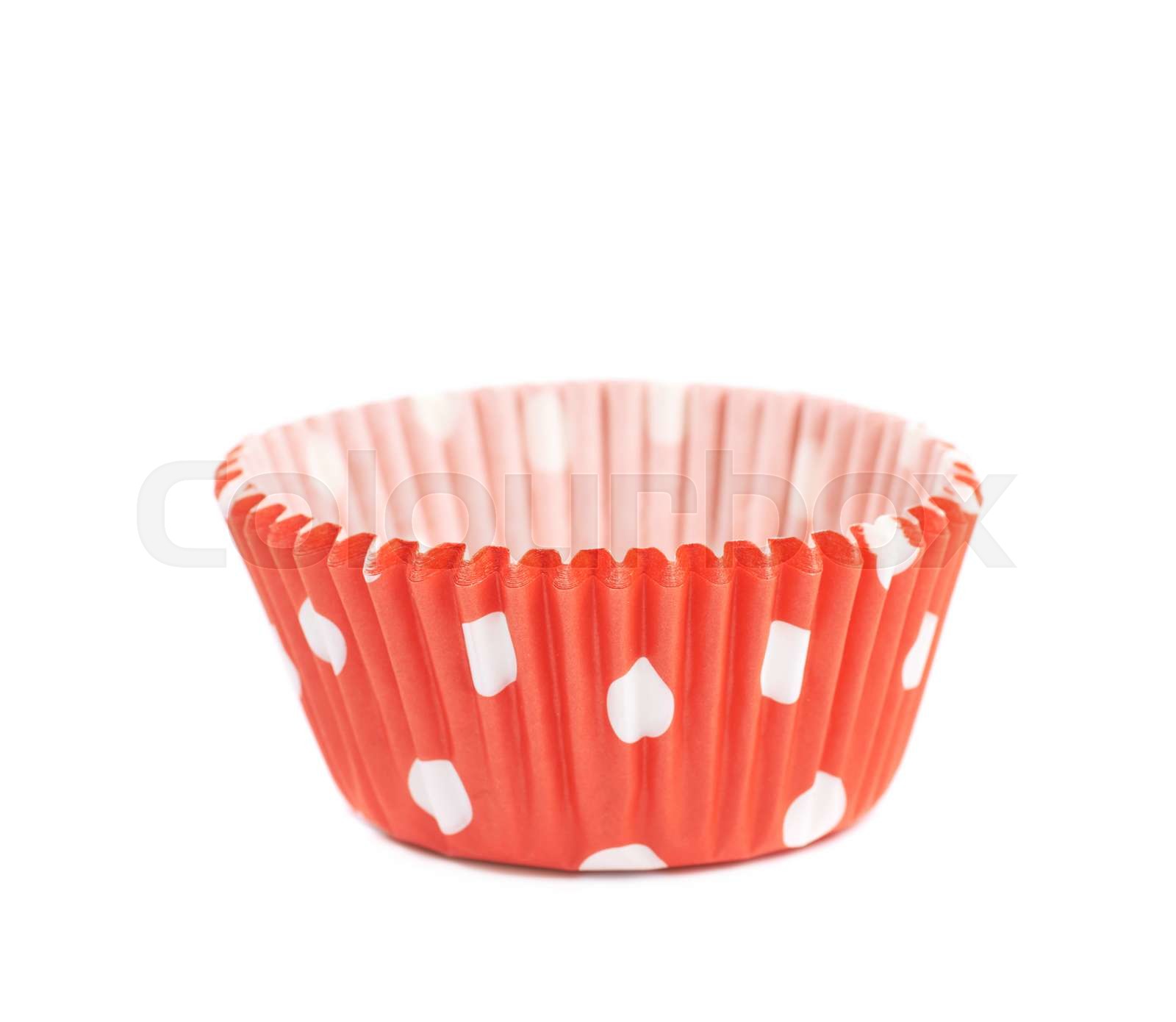 Red polka dot cupcake cup isolated | Stock image | Colourbox