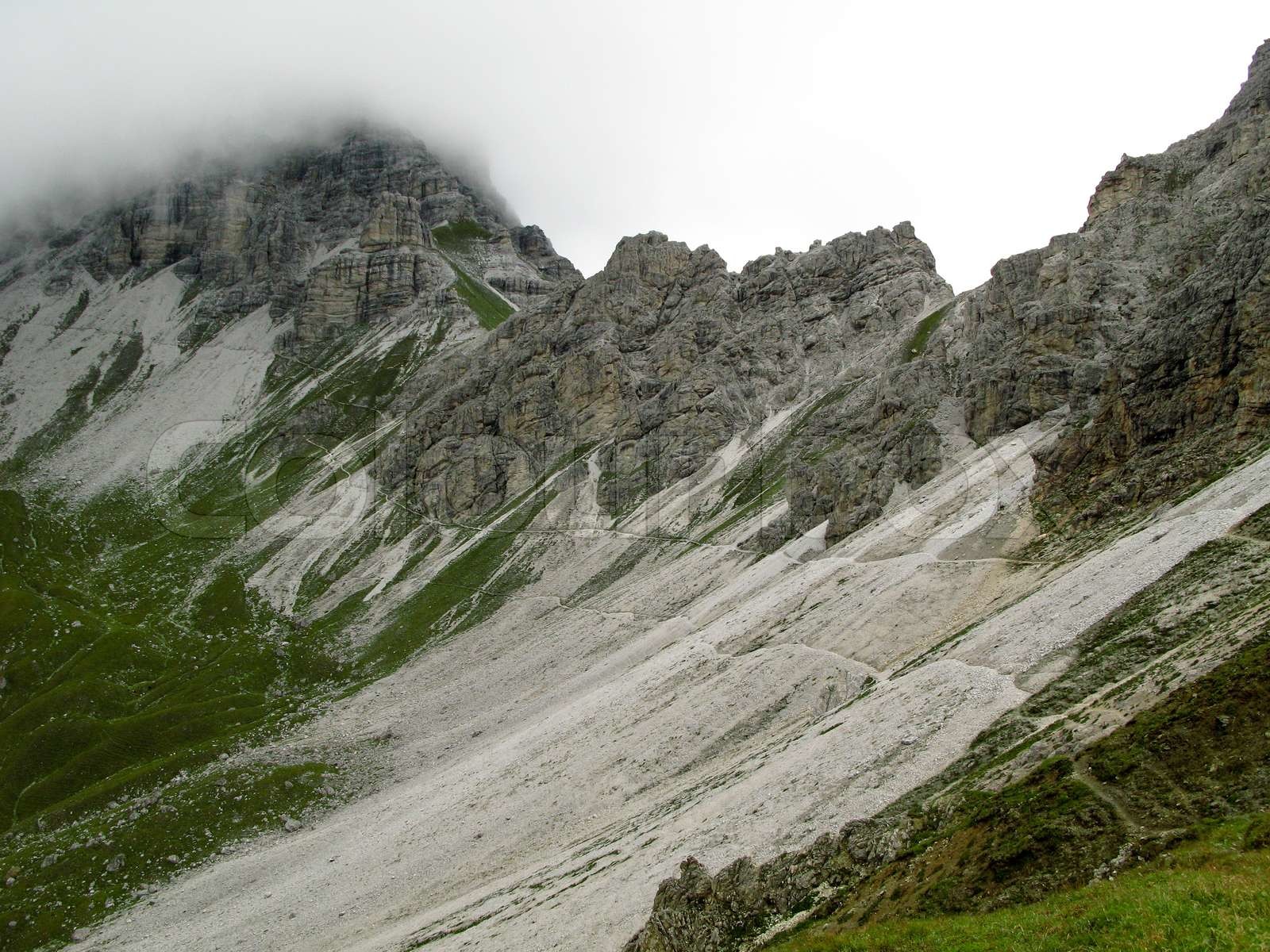 small walking path in the alps on a steep slope | Stock image | Colourbox