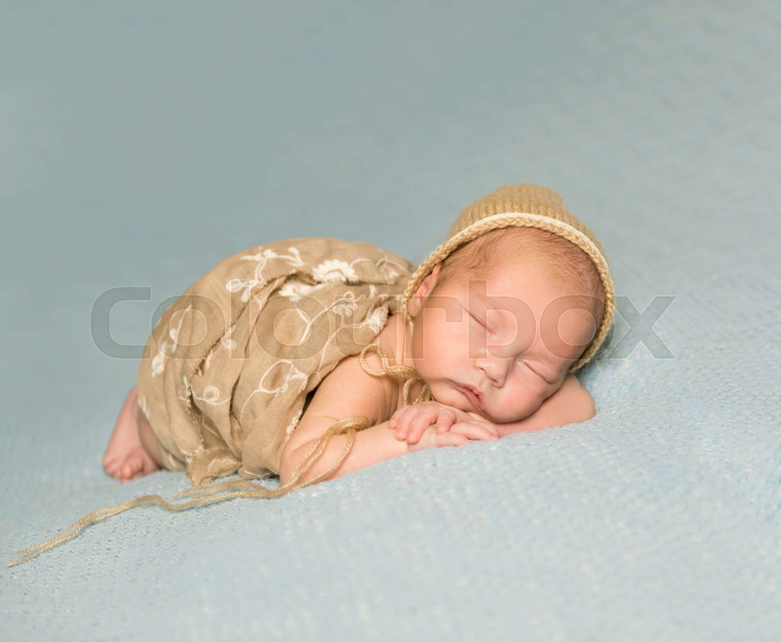 sleeping newborn baby with lovely cheeks | Stock image | Colourbox