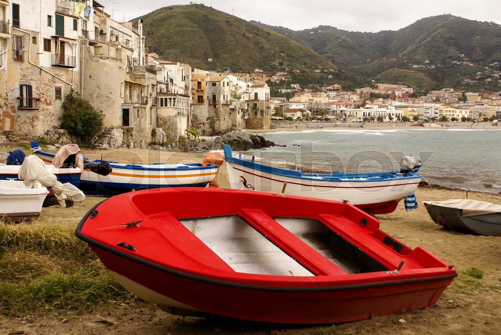 Sicilian fishing boat on the beach in Cefalu, Sicily | Stock image ...