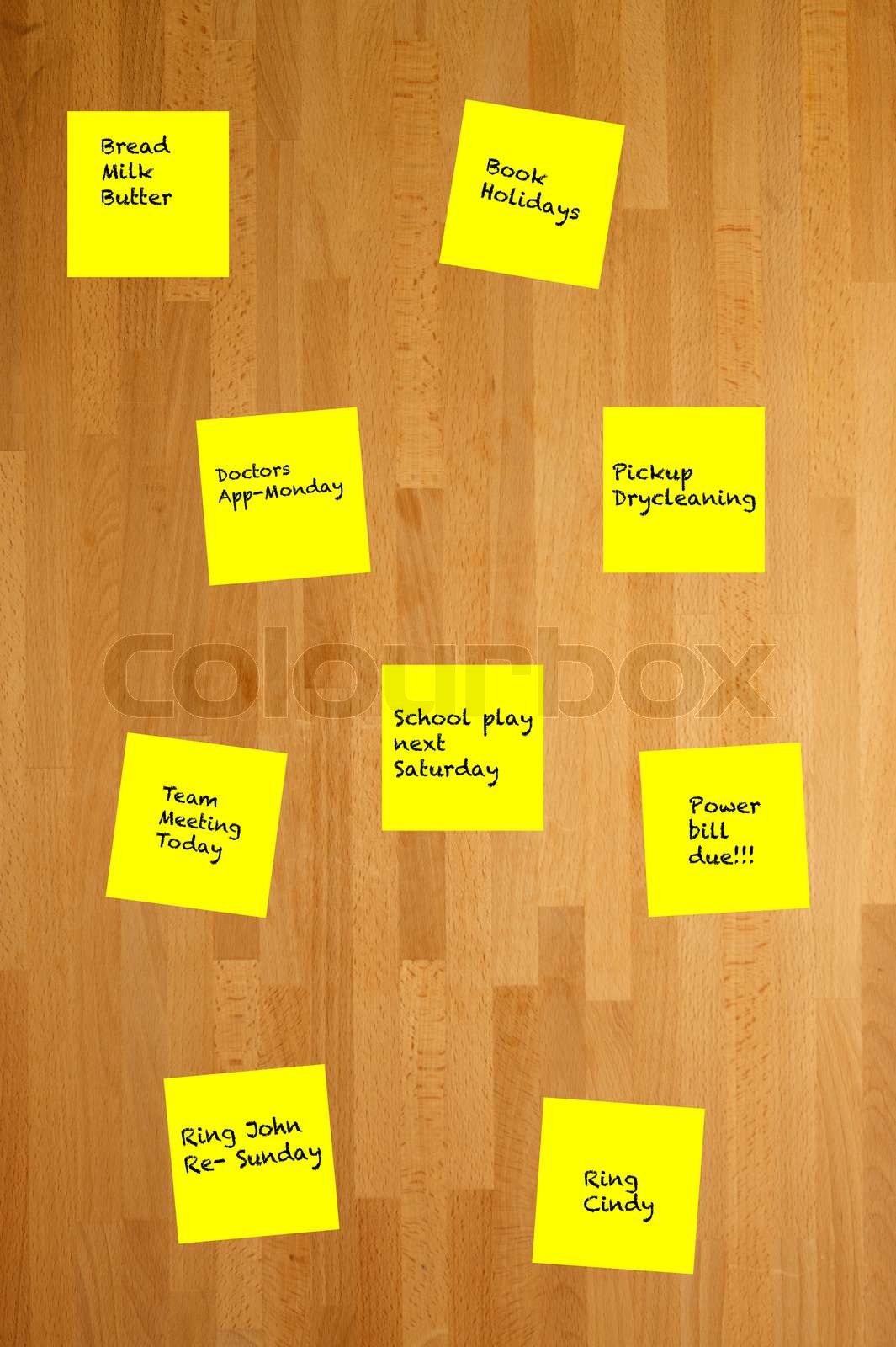 Post it notes stuck to a wooden wall | Stock image | Colourbox