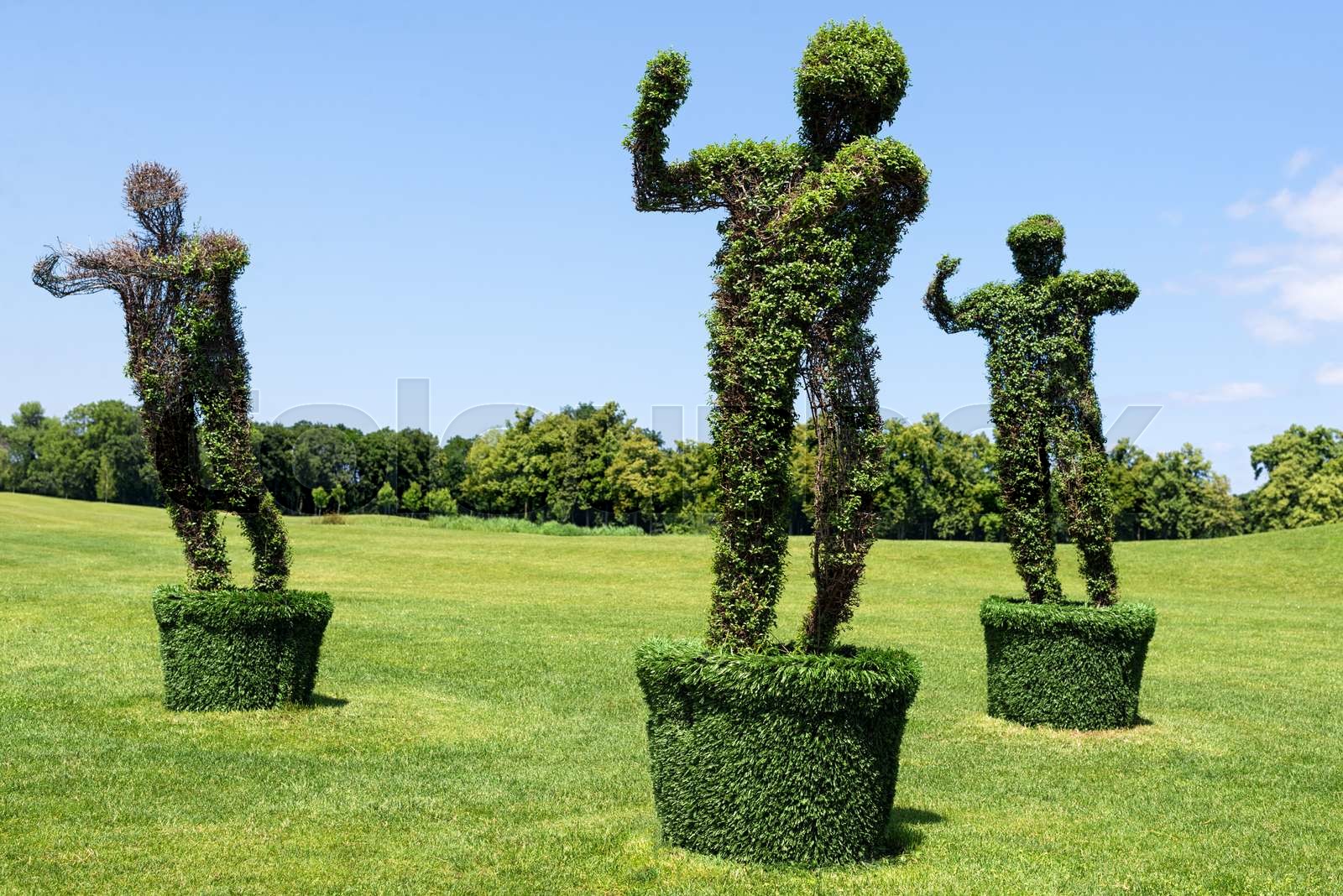 Topiary Garden Sculpture made of grass - man figure. Eco and nature ...