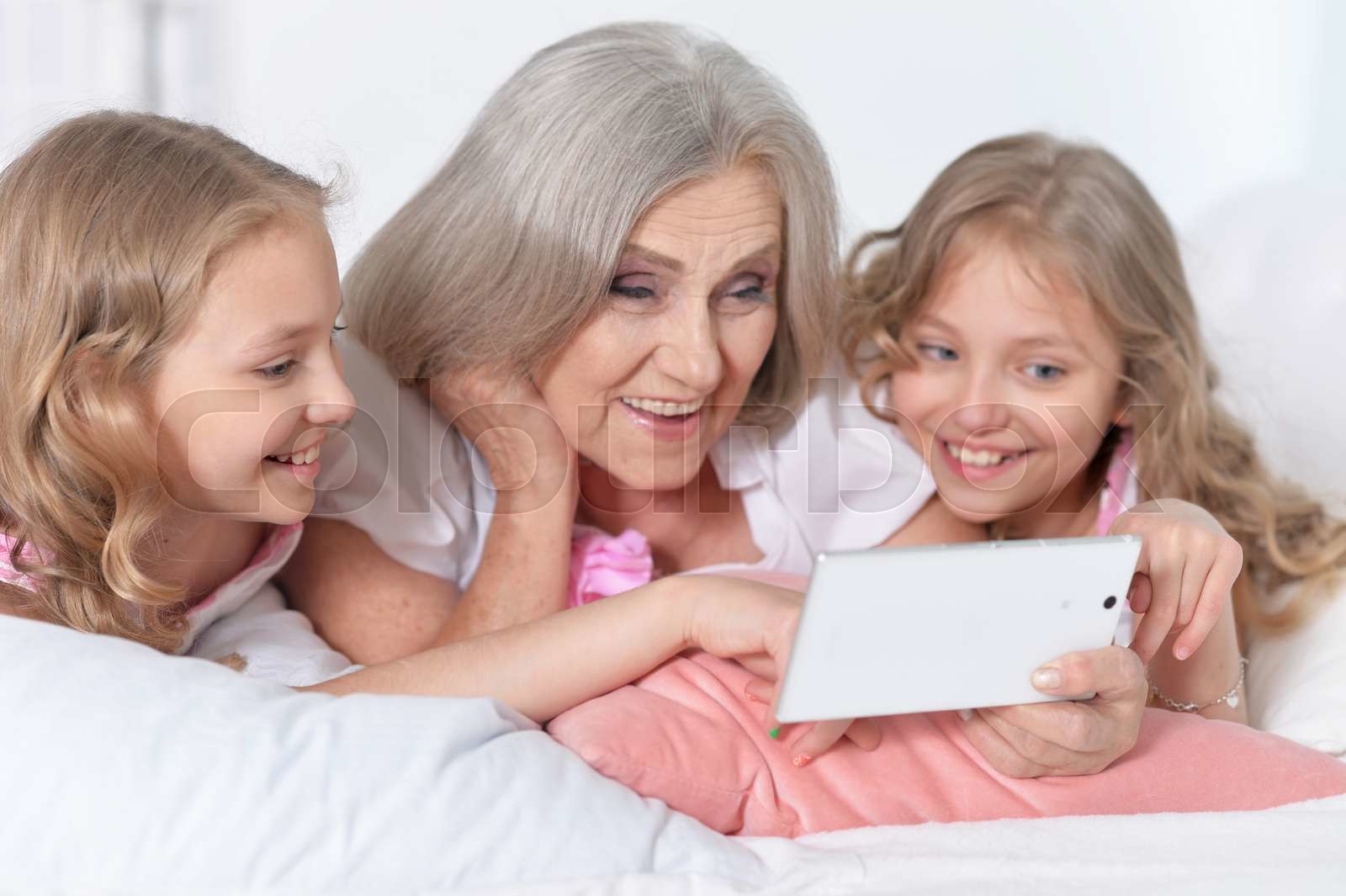 Woman With Tweenie Girls Doing Selfie Stock Image Colourbox