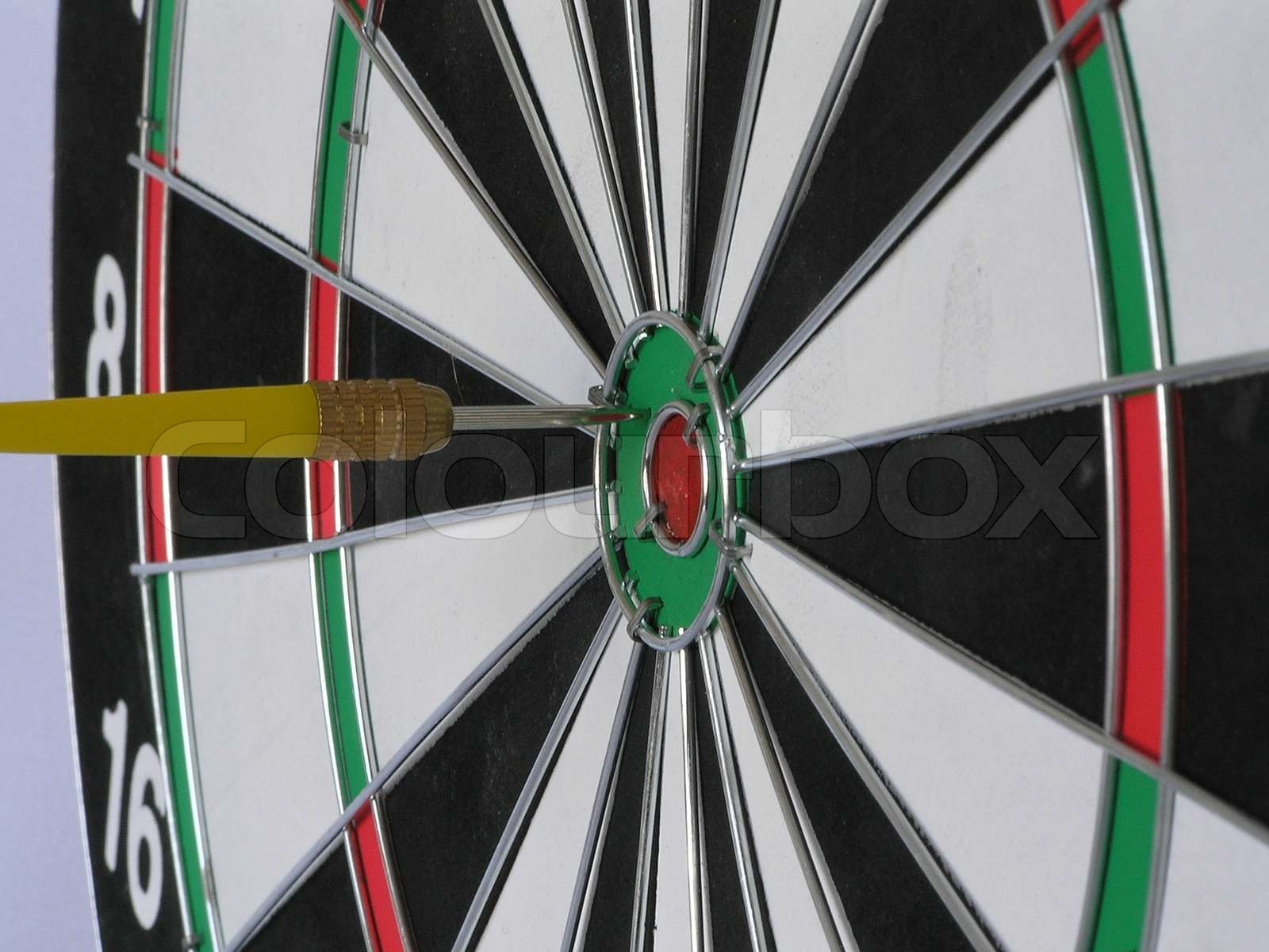 On a photo game of a darts. The target of different colors is divided ...