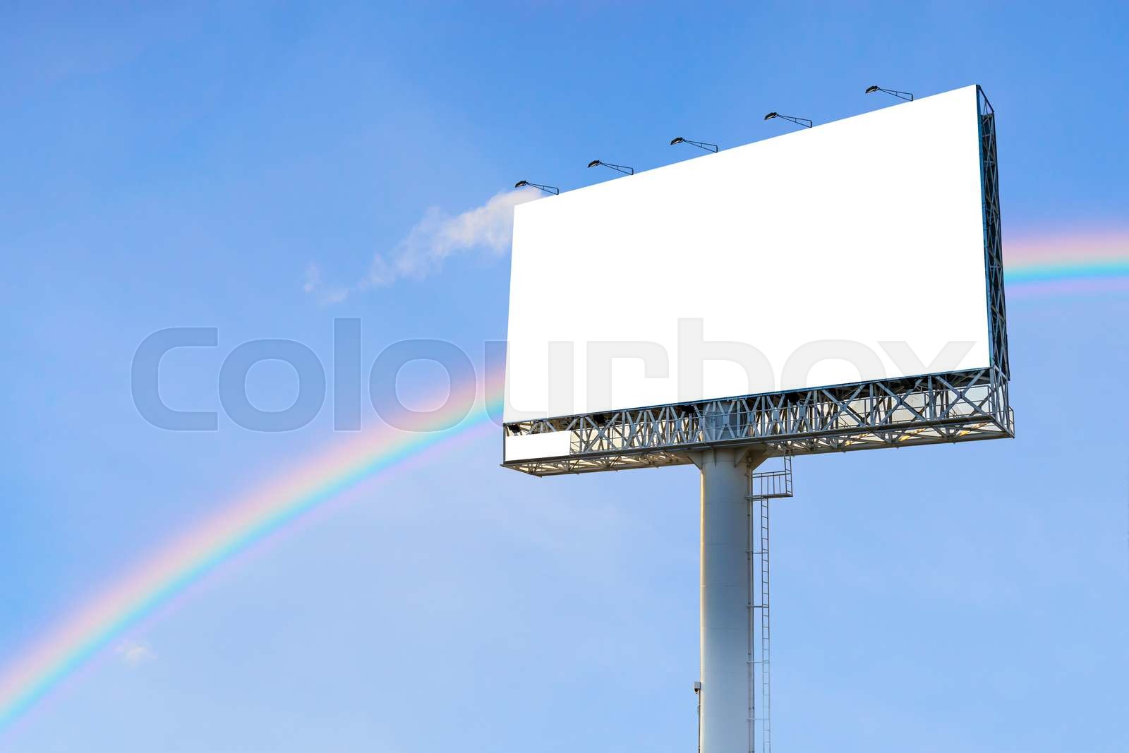 Blank billboard with blue sky and beautiful rainbow for advertisement ...