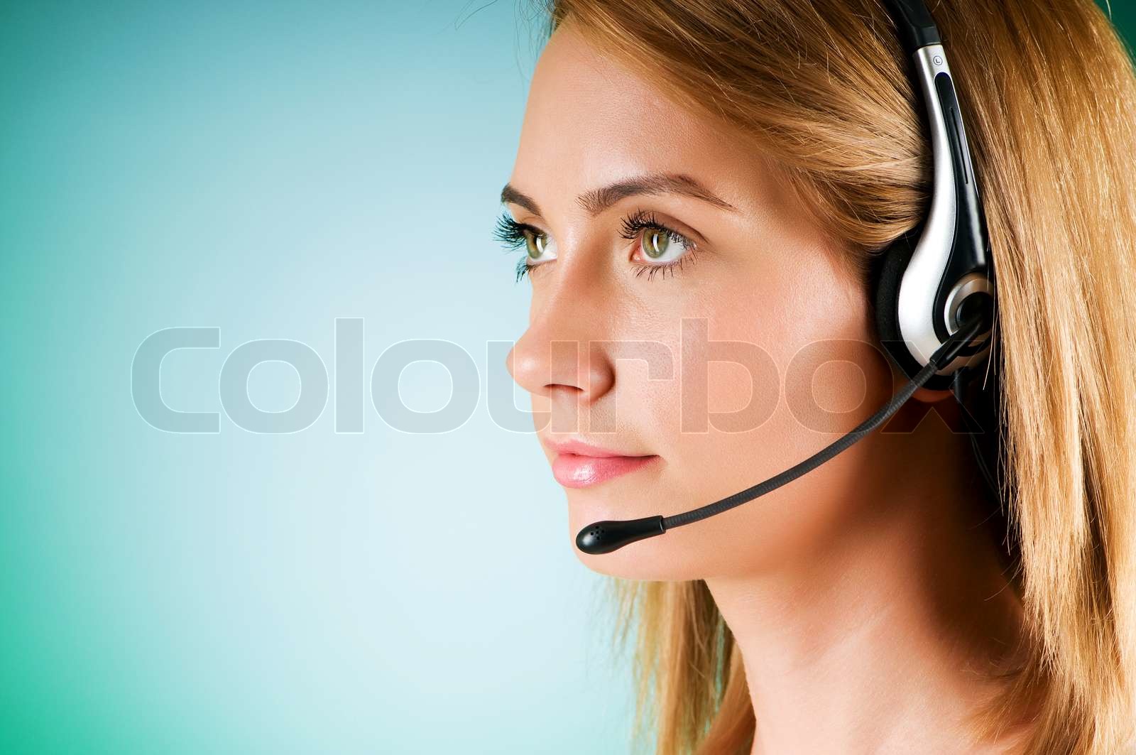 Young call center operator with the headset | Stock image | Colourbox