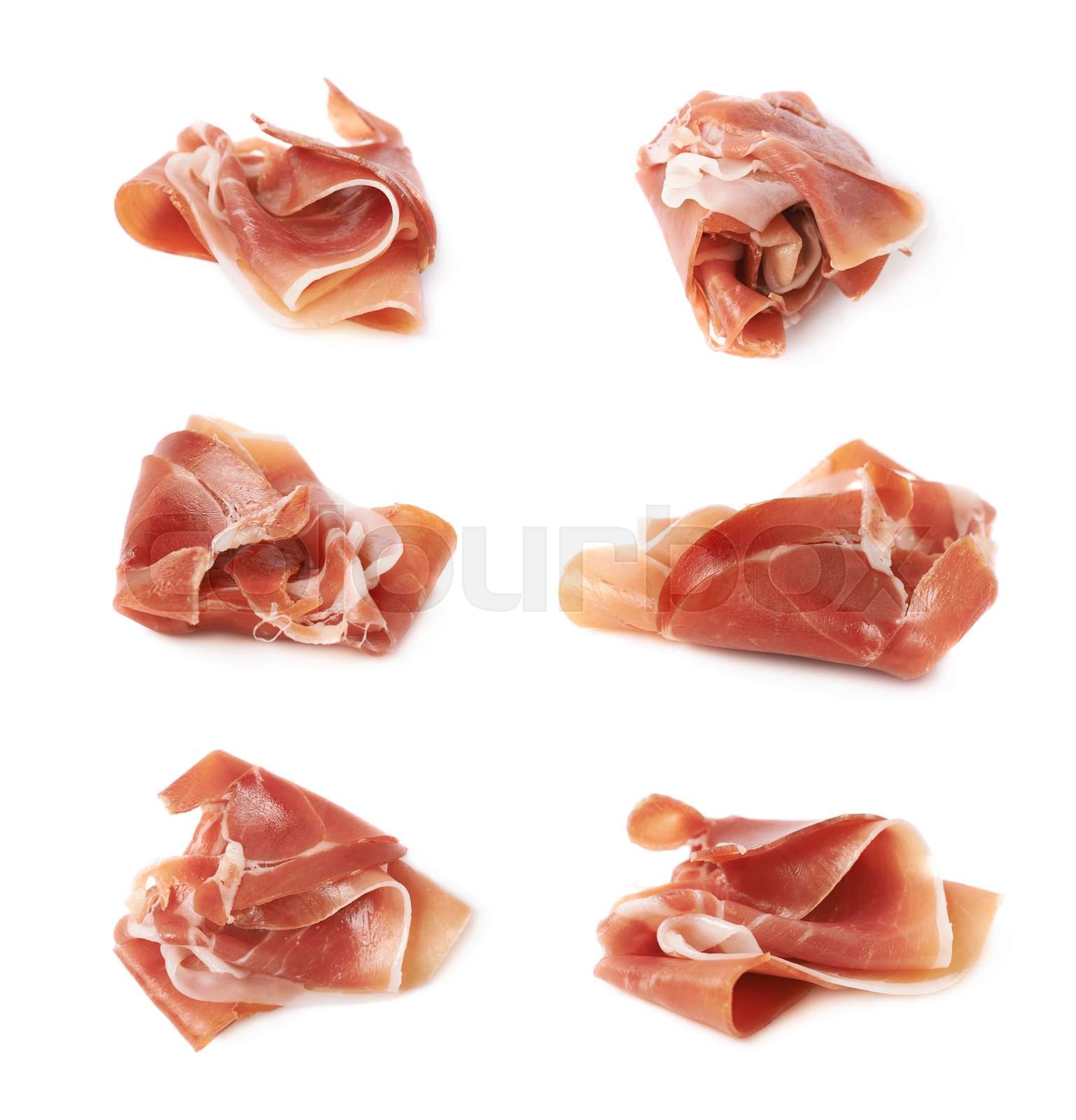 Folded prosciutto ham slice isolated | Stock image | Colourbox
