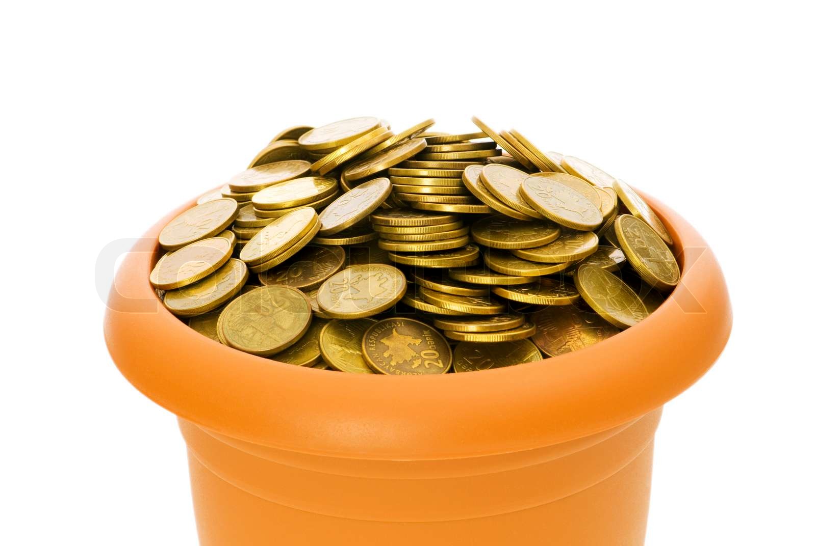 Many coins in the clay pot on white | Stock image | Colourbox
