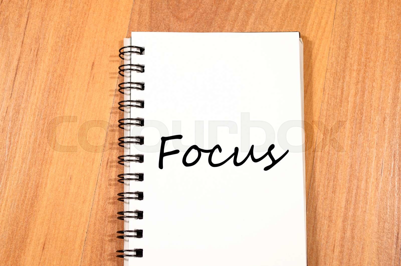 Focus write on notebook | Stock image | Colourbox
