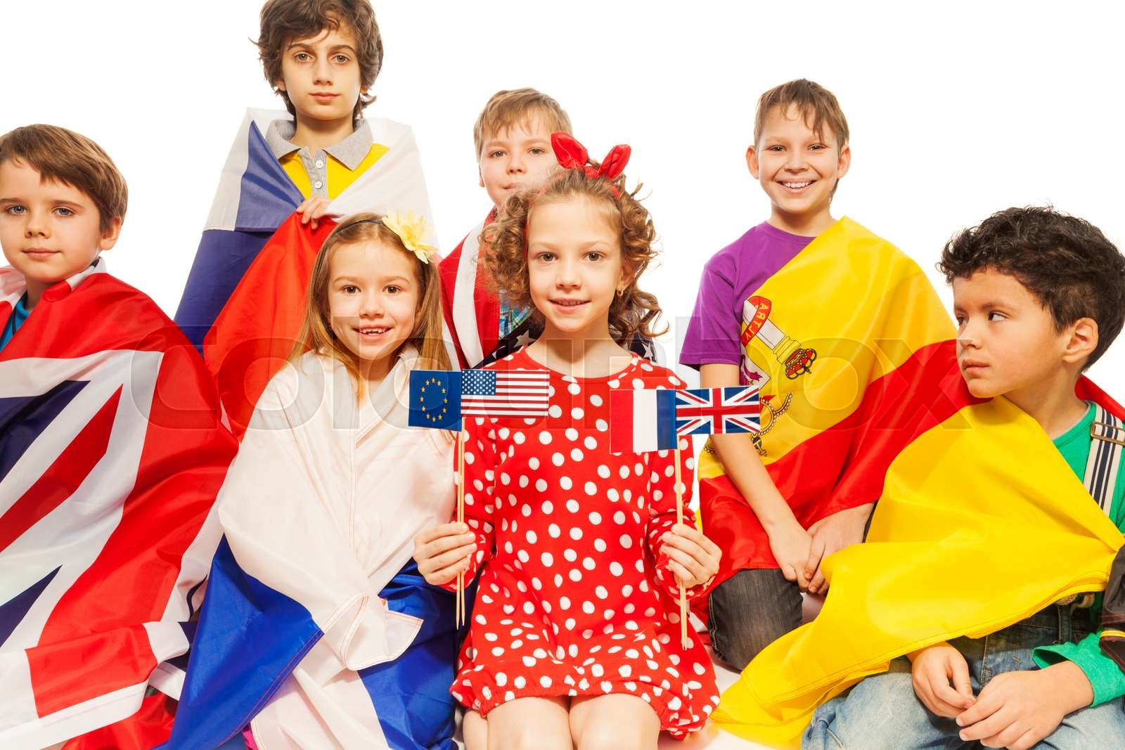 Children with flags wrapped in different banners | Stock image | Colourbox