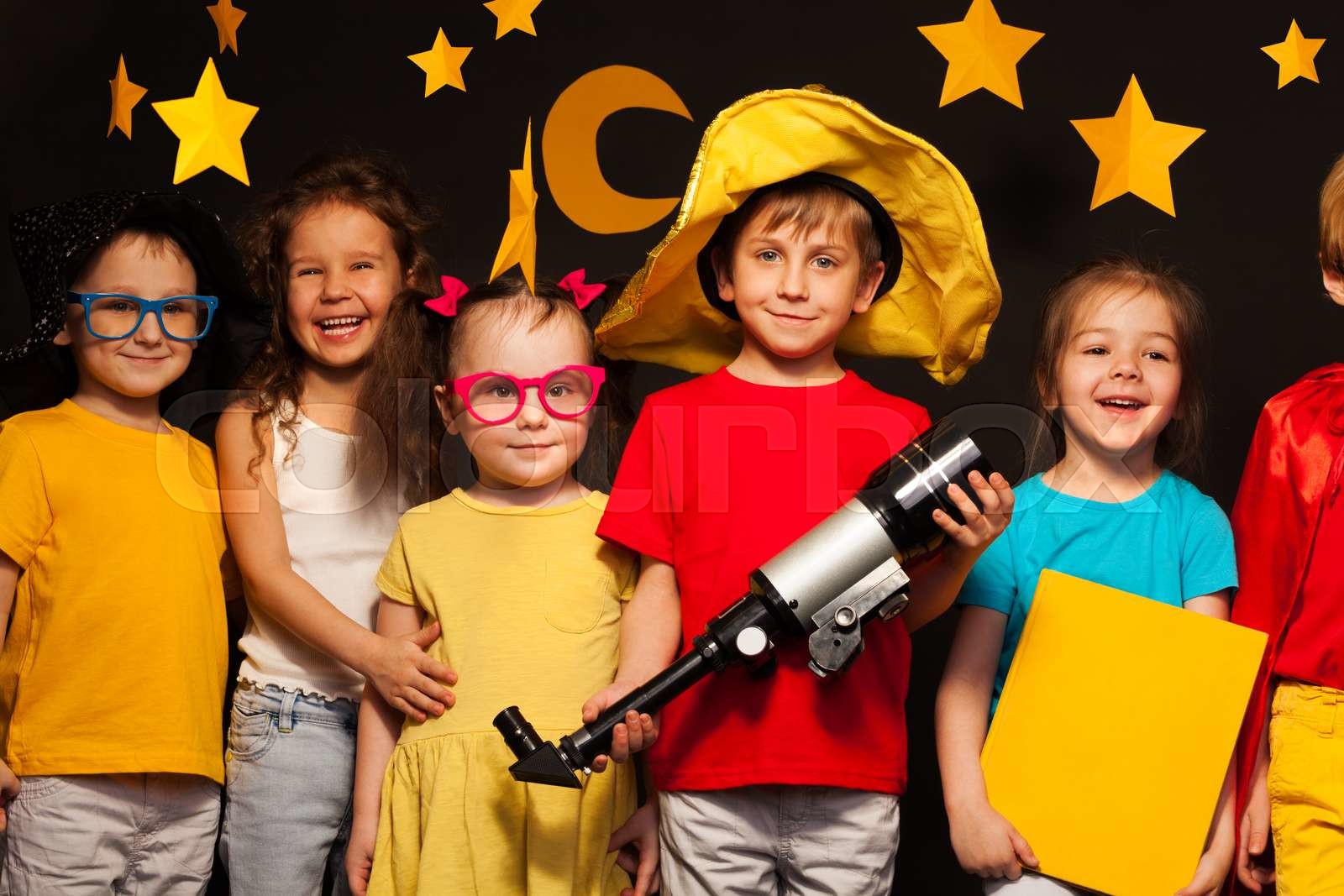 Group of happy friends playing sky watchers | Stock image | Colourbox