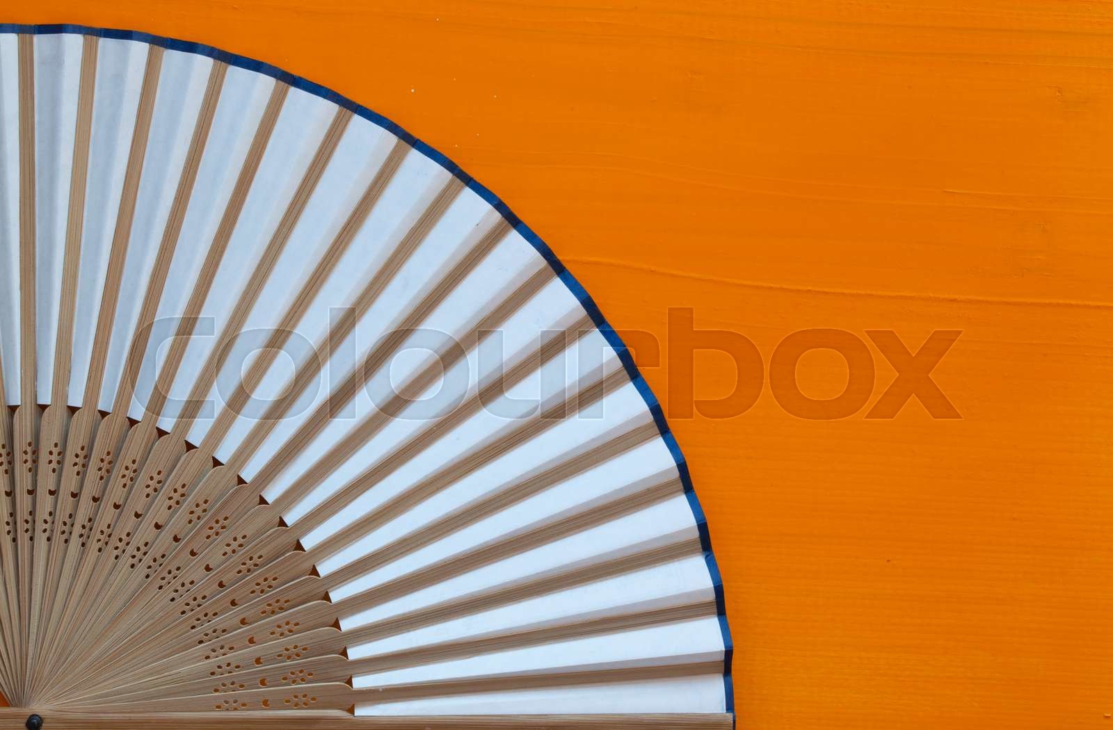 Typical Japanese hand fan made on the wooden orange desk | Stock image ...