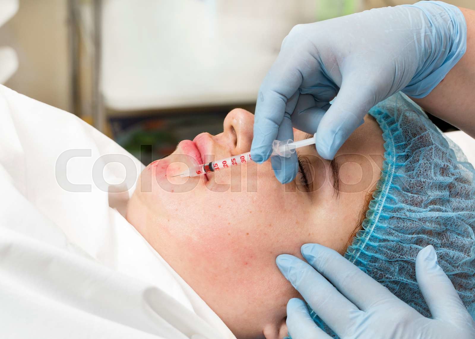 Cosmetic treatment with injection in a clinic | Stock image | Colourbox