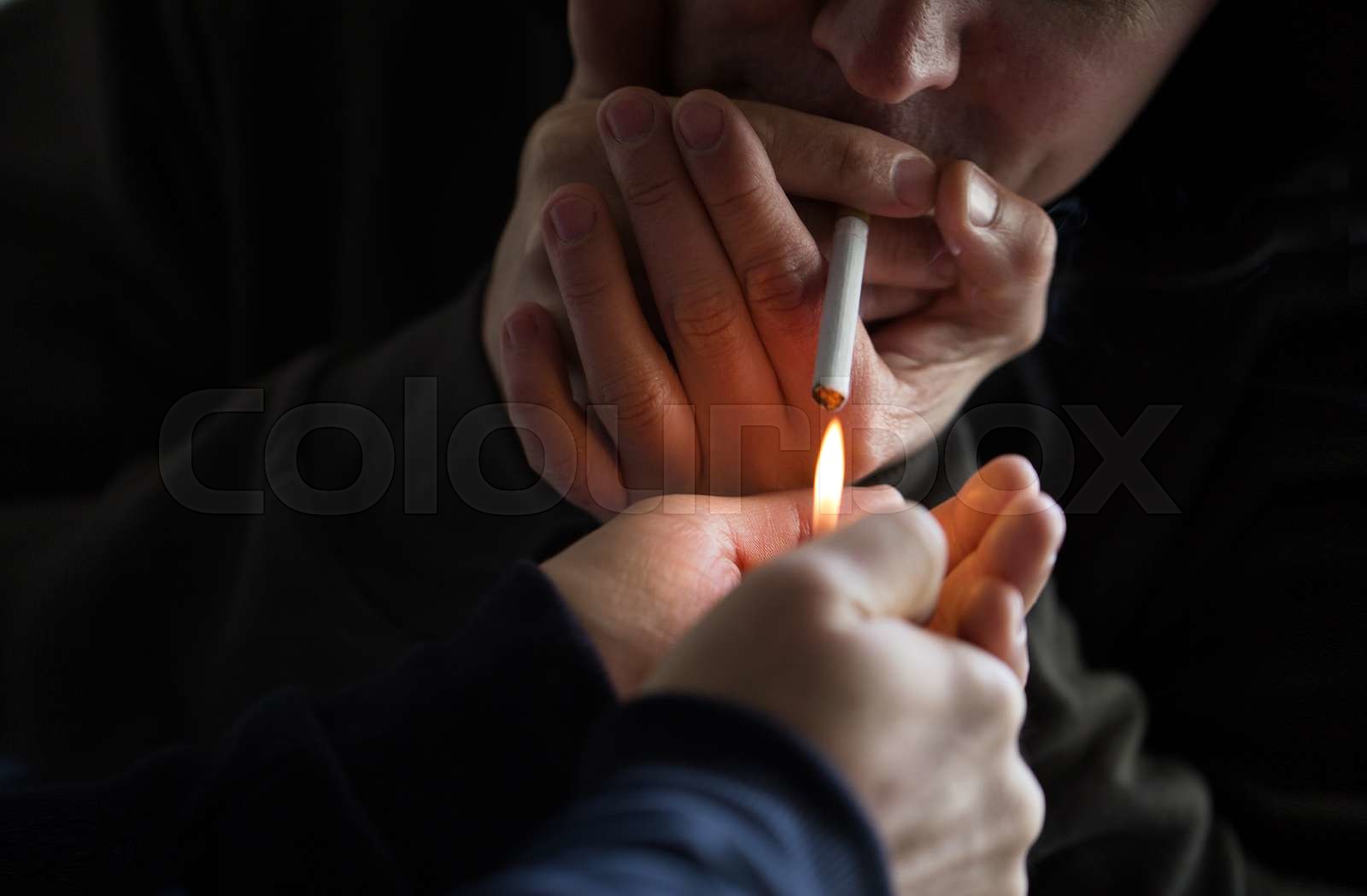 close up of young people smoking cigarette | Stock image | Colourbox