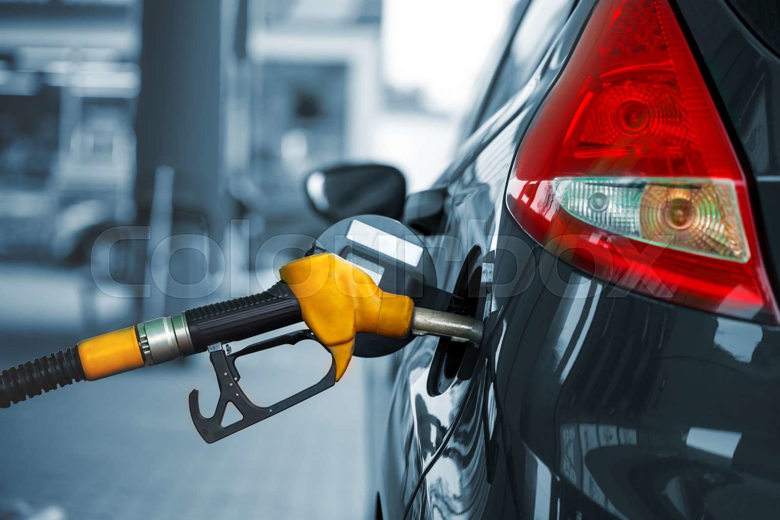 Car refueling on a petrol station | Stock image | Colourbox