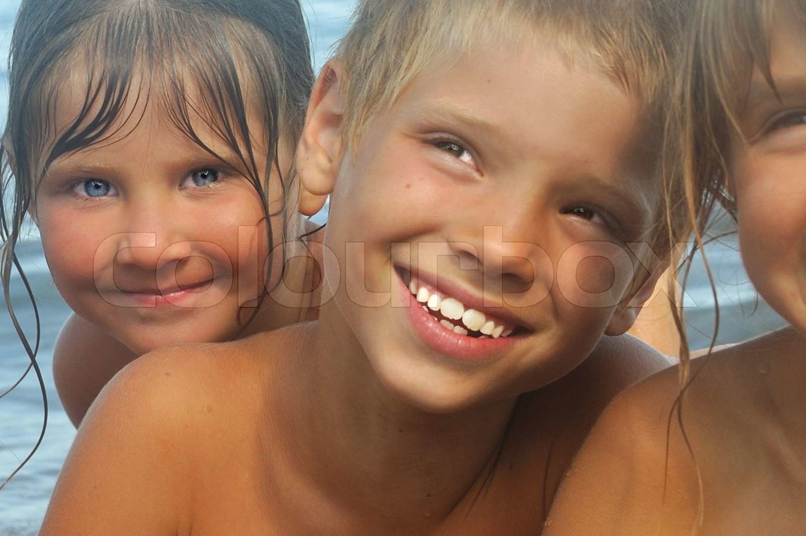 happy smilingchildren playing on the beach | Stock image | Colourbox