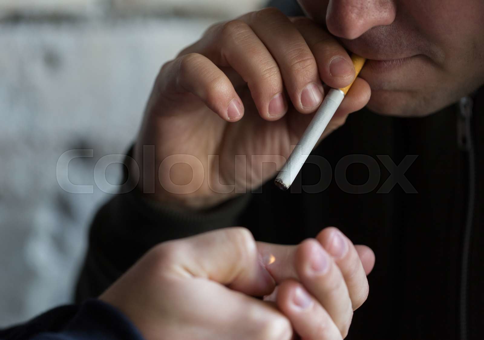 close up of young people smoking cigarette | Stock image | Colourbox