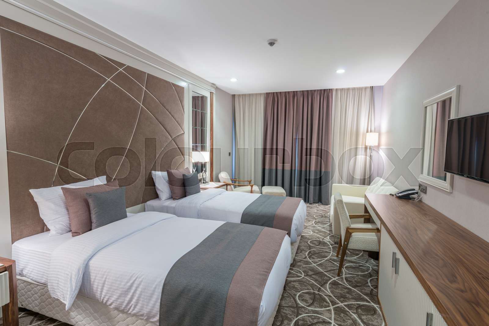 Modern hotel room with big bed | Stock image | Colourbox