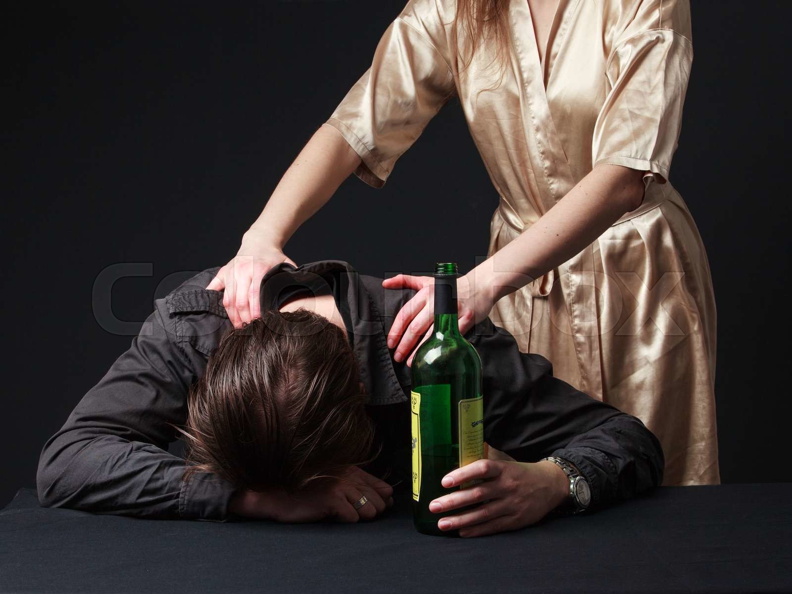 Alcohol addiction, black background | Stock image | Colourbox