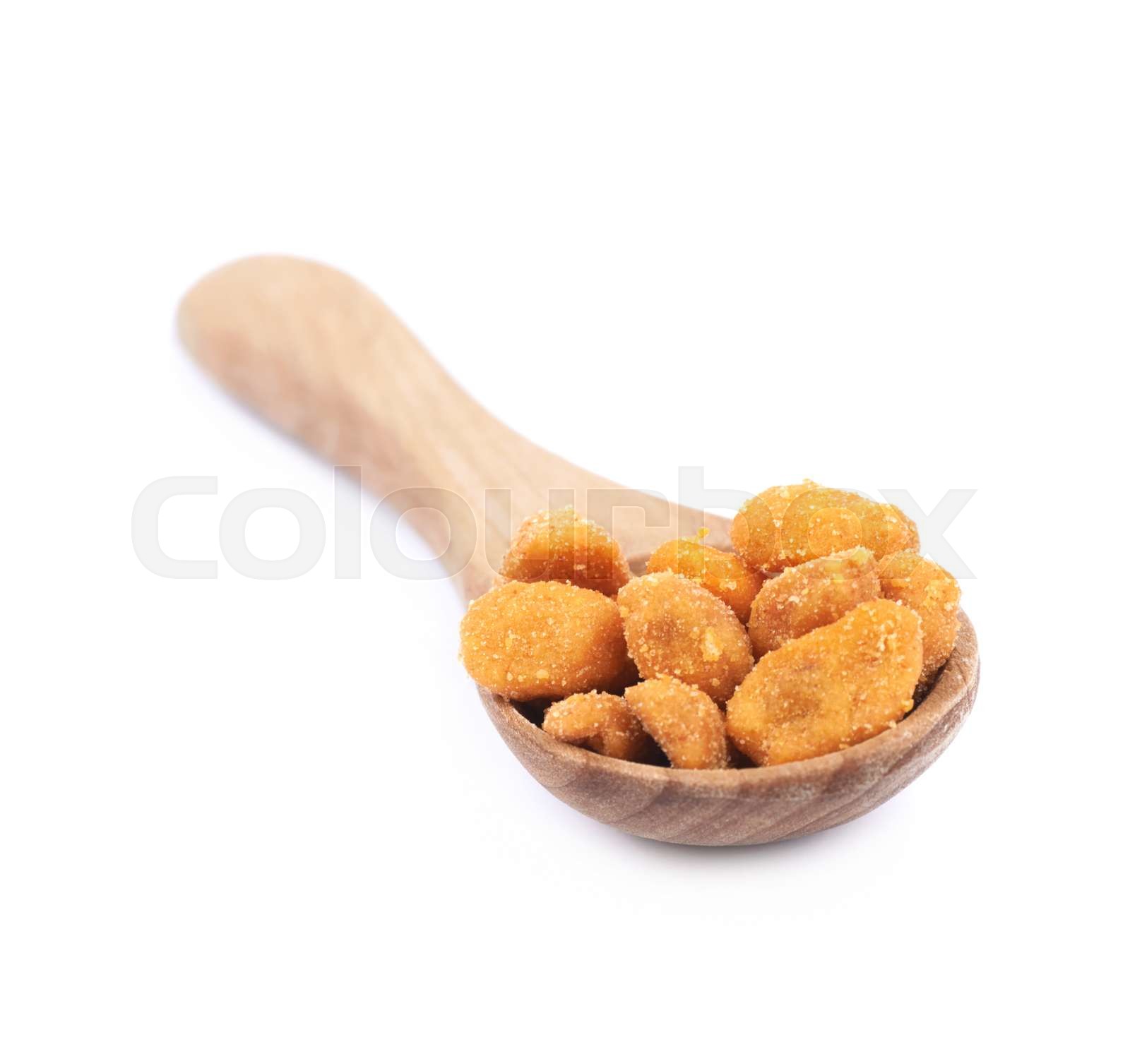 Spoon filled with the breaded peanuts | Stock image | Colourbox