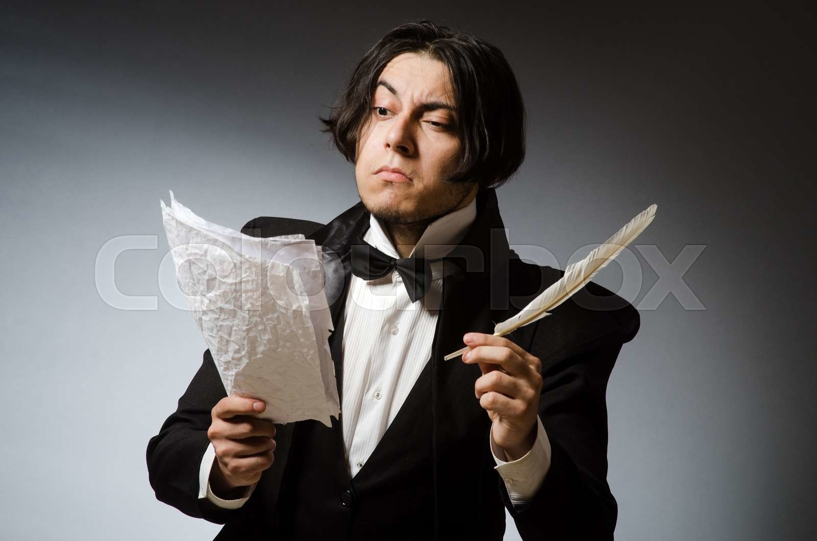 Funny writer with quill in vintage concept | Stock image | Colourbox
