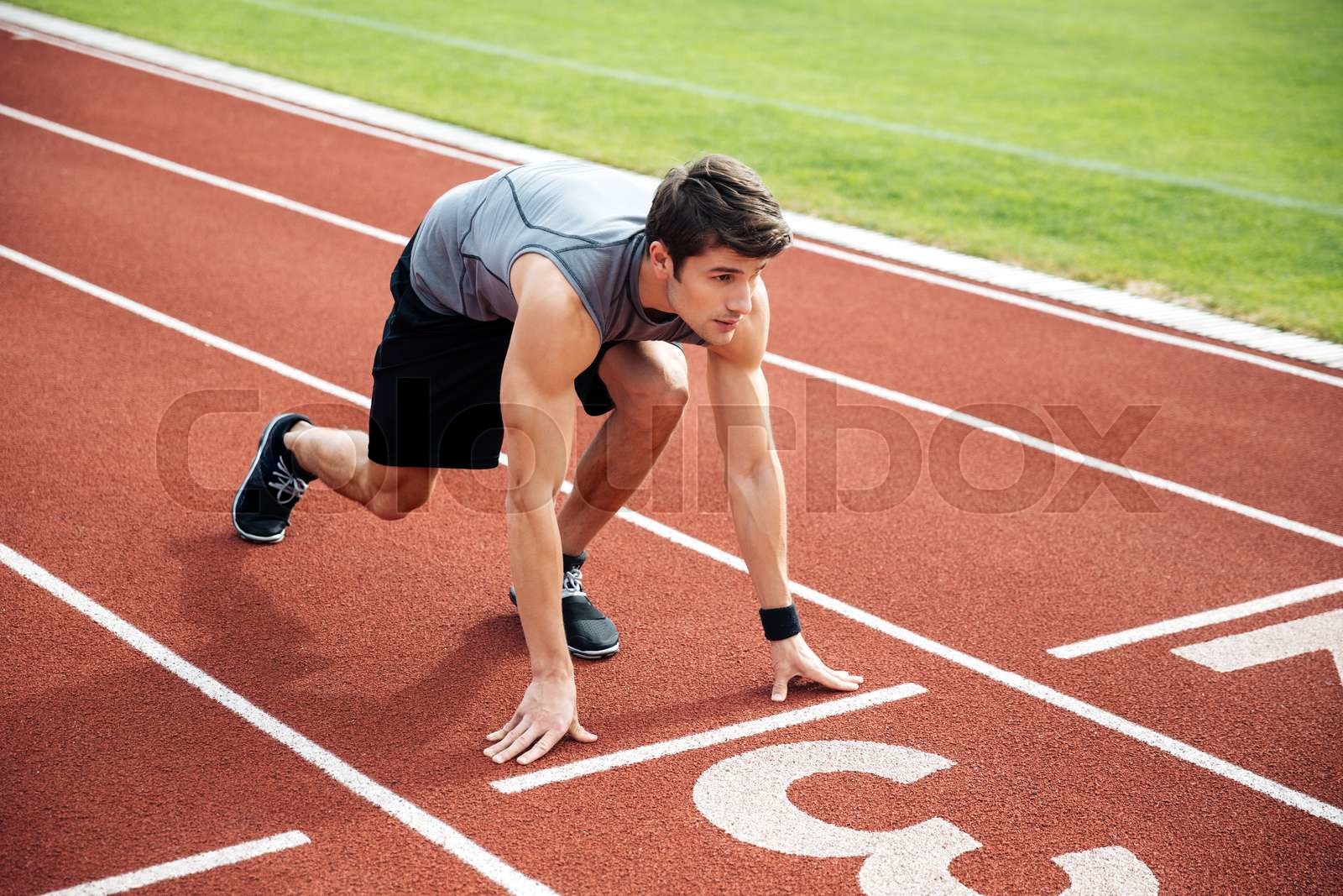 Portrait of the athlete ready to run | Stock image | Colourbox